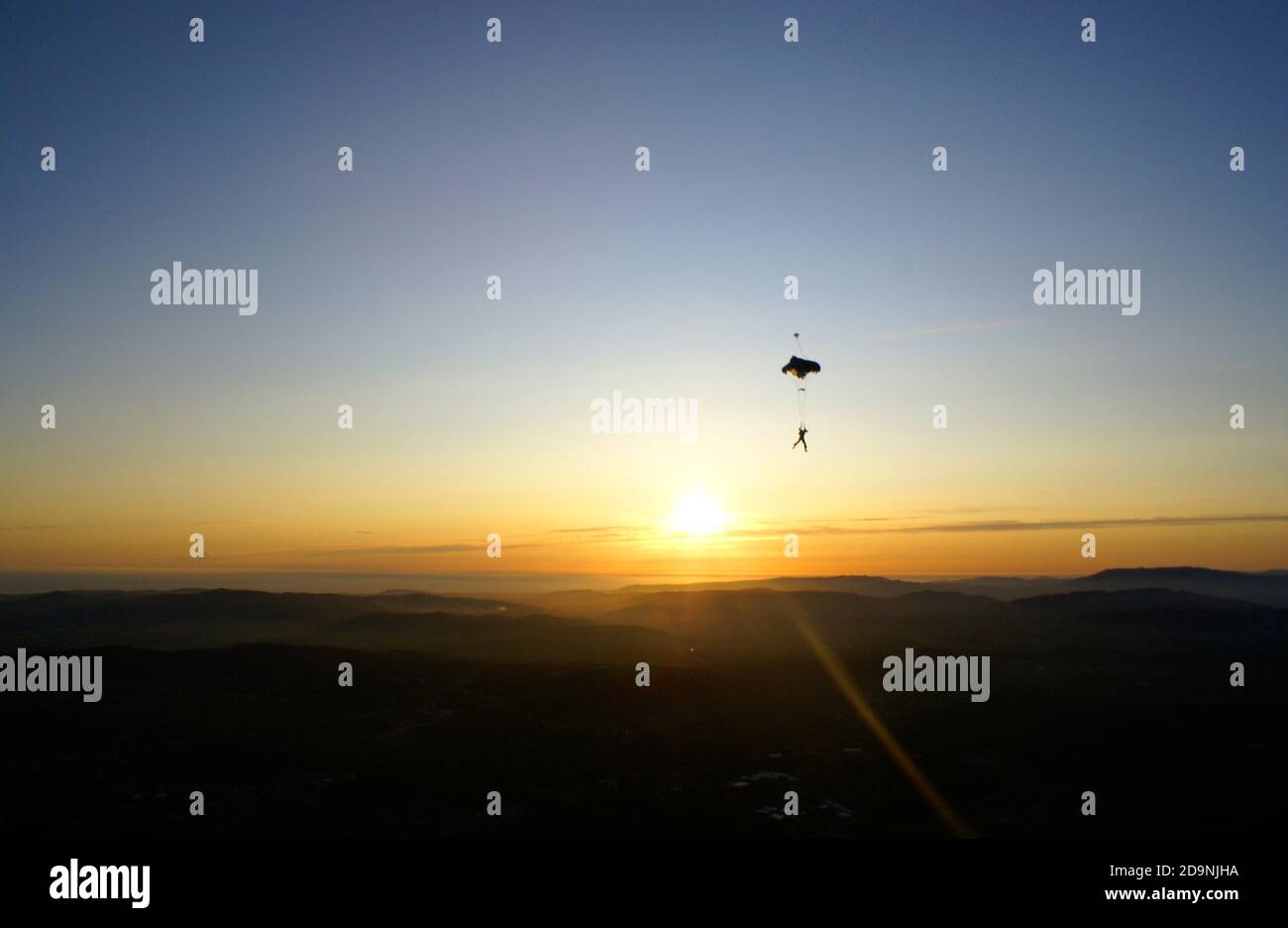 Skydiving Landscape opening at the sunset Stock Photo - Alamy