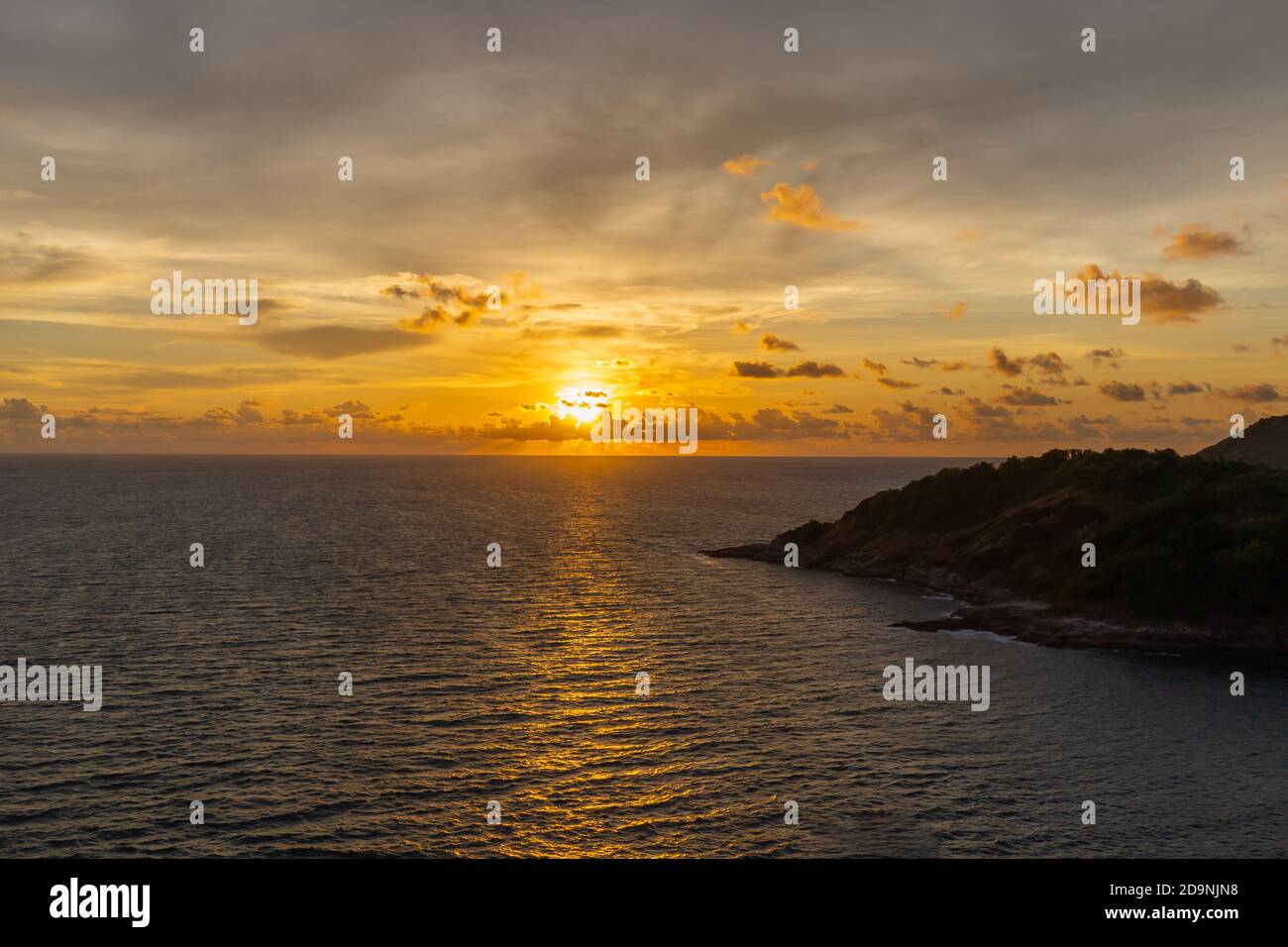 The sunset at Promthep Cape with mountains and sea in front. Is a ...