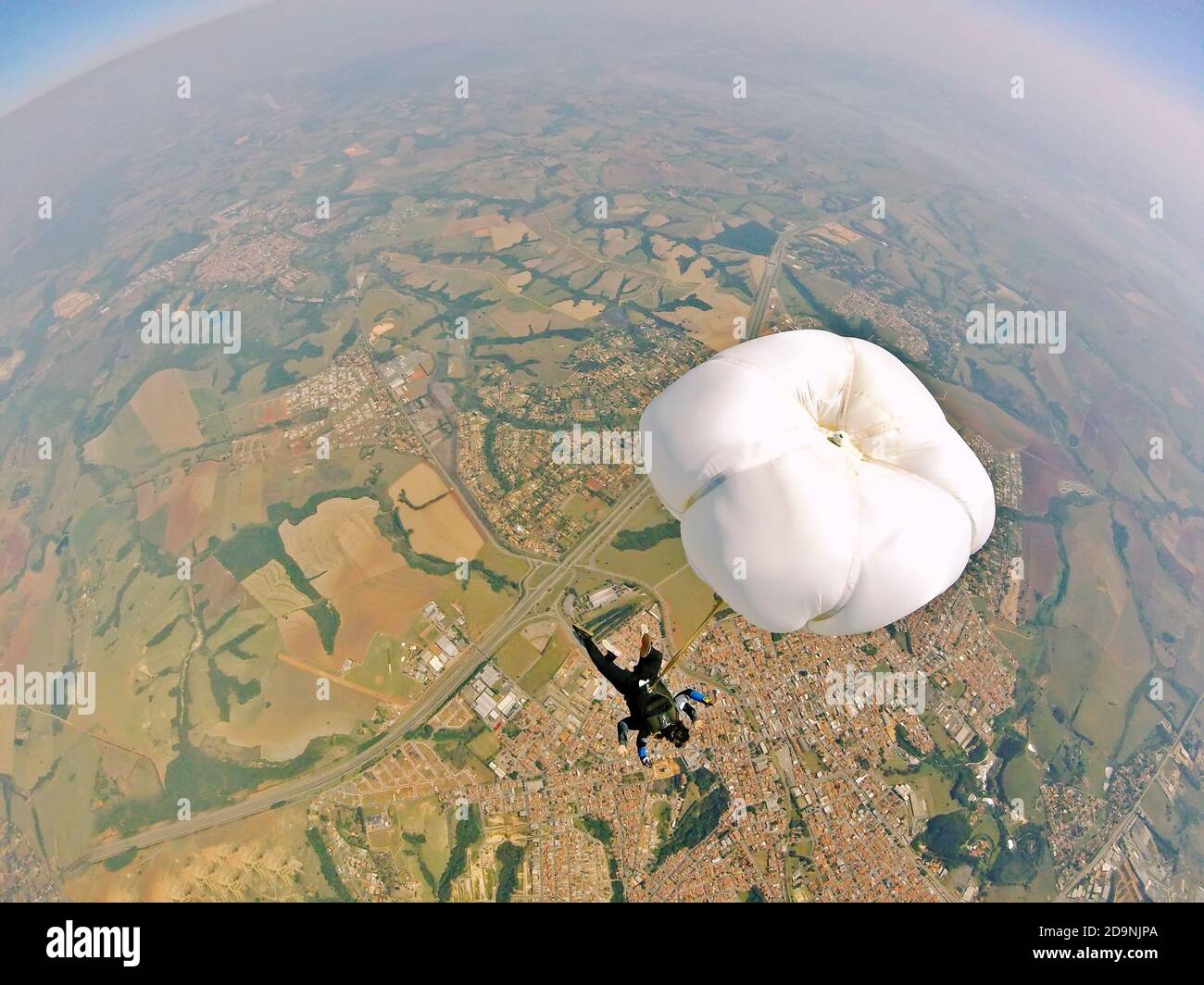 Skydiving Landscape opening at the sunset Stock Photo - Alamy