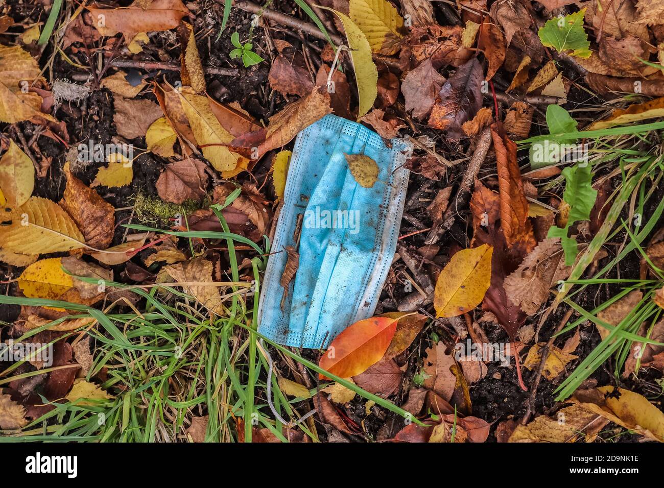 High angle shot of a used mask on the ground Stock Photo - Alamy