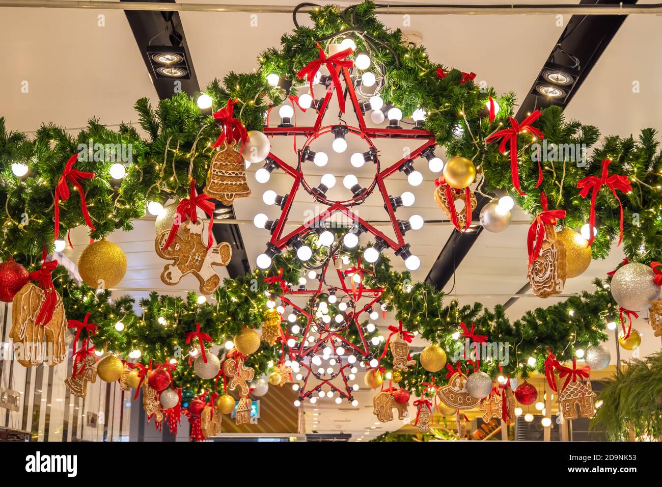 Christmas lights decorated with props, stars and balls on the ceiling ...