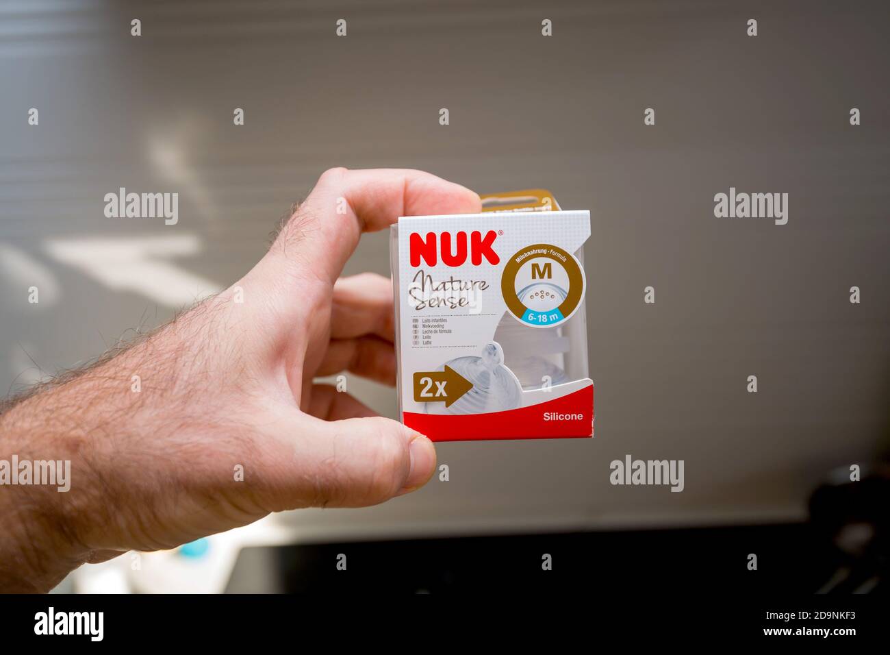 Paris, France - Nov 4, 2020: POV male hand holding new NUK nature sense ...
