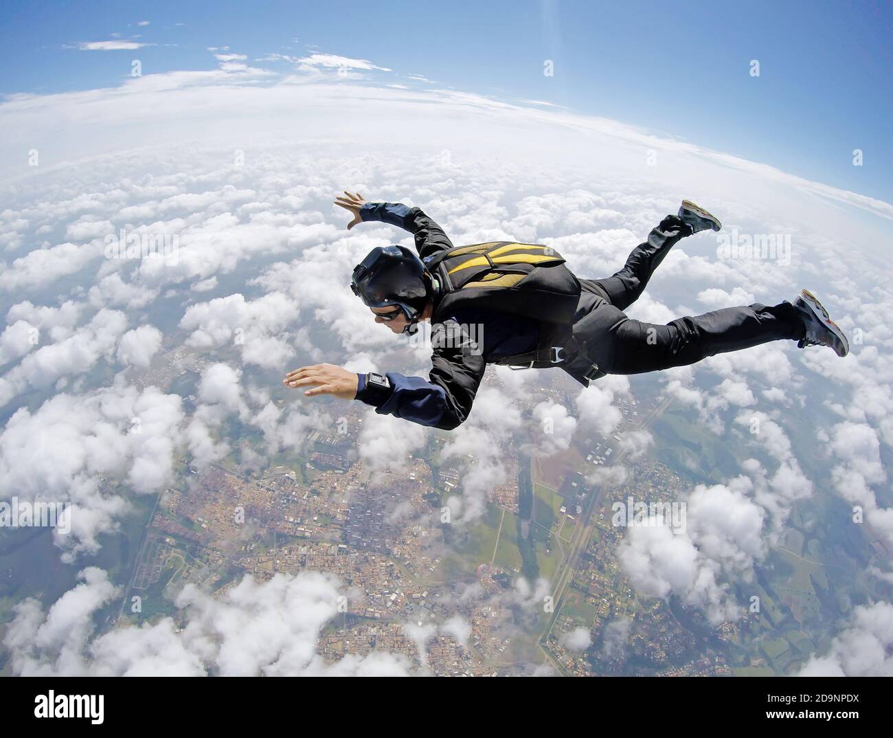 Skydiver Cloudscape speed dive to the ground Stock Photo - Alamy