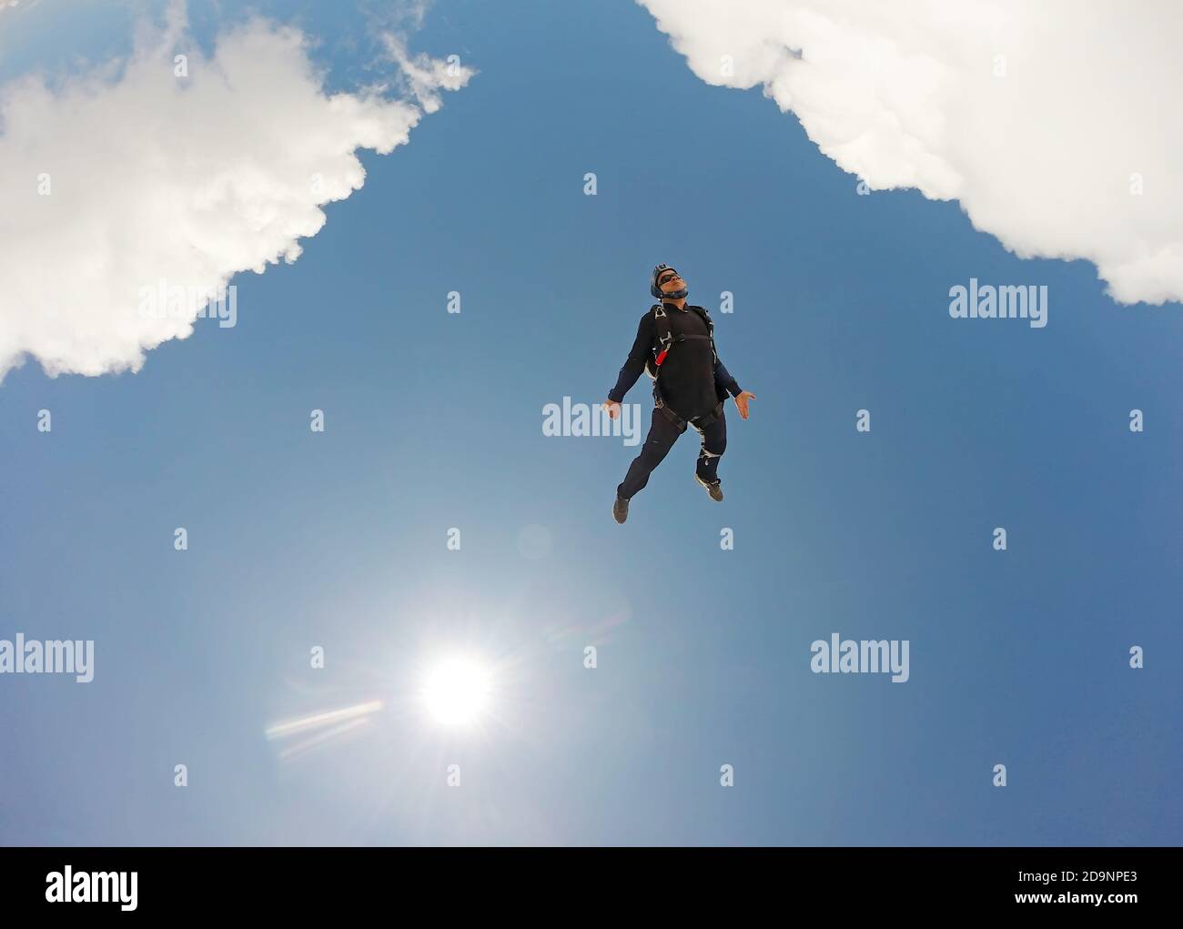 Skydiver Cloudscape speed dive to the ground Stock Photo - Alamy