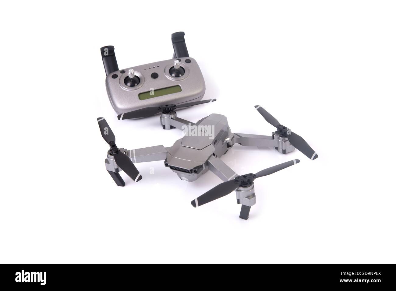 Small drone with remote control on white background Stock Photo - Alamy