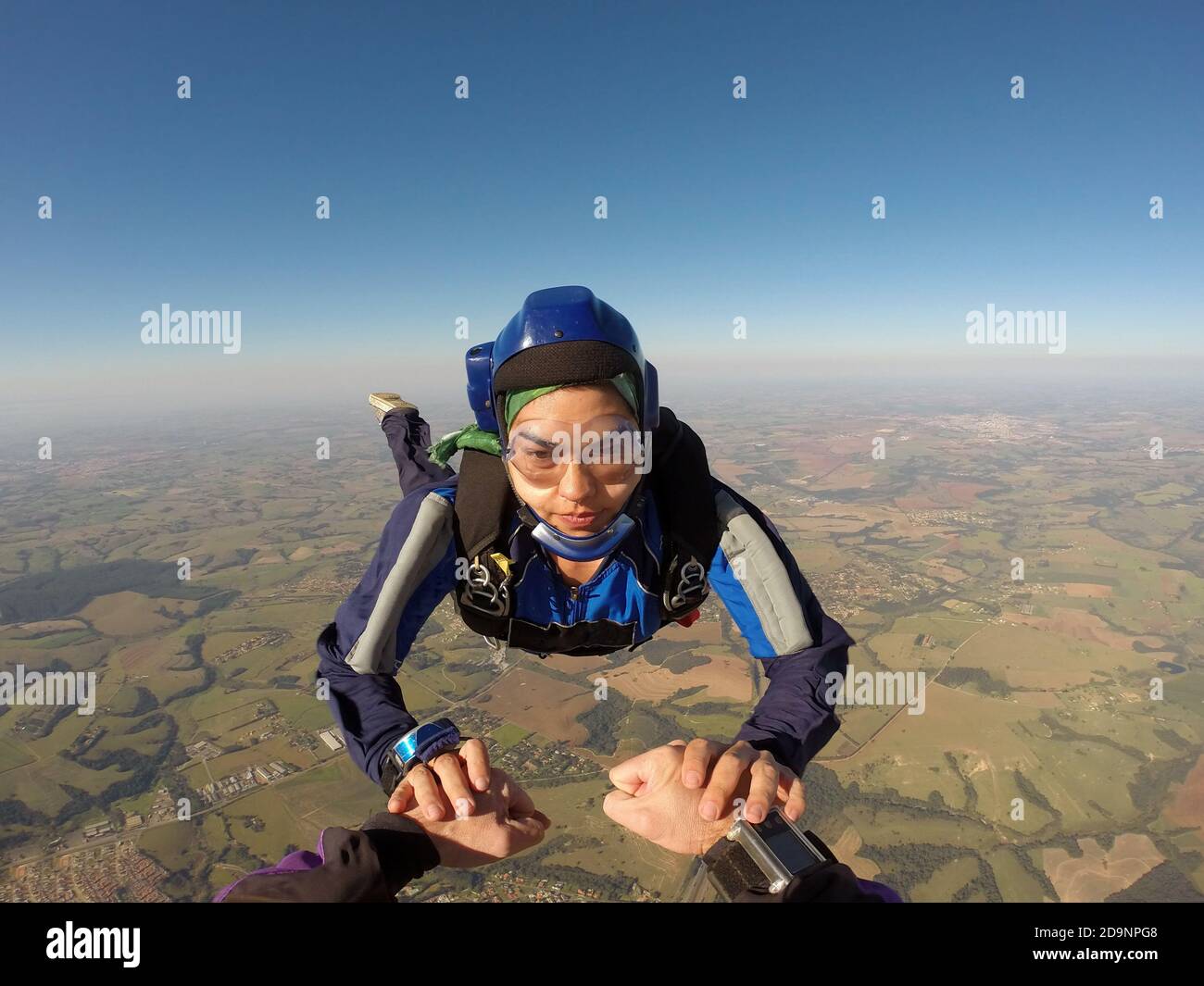 Sky diving asian female smiling Stock Photo - Alamy