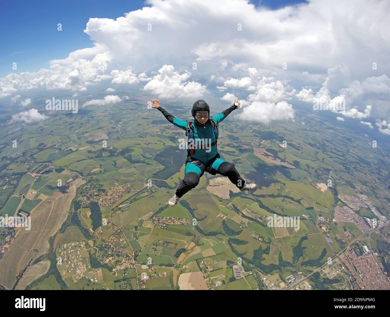 Skydiver woman falling in sitting control Stock Photo - Alamy
