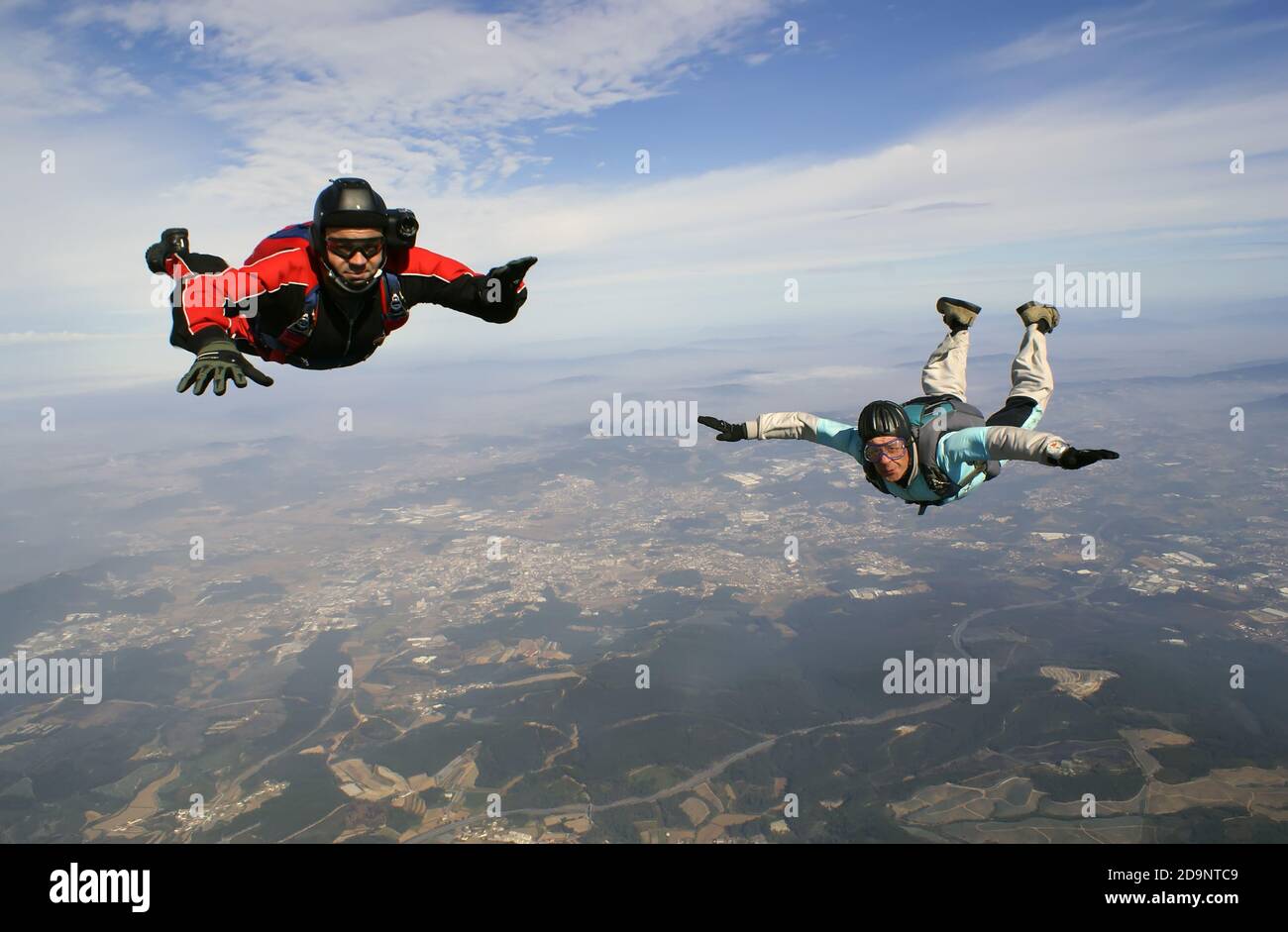 Two skydiver in free fall. Winter day Stock Photo - Alamy