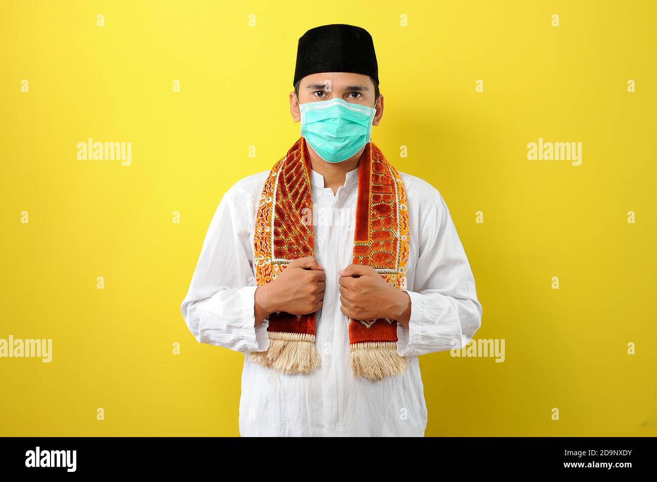Man standing on prayer mat hi-res stock photography and images - Alamy