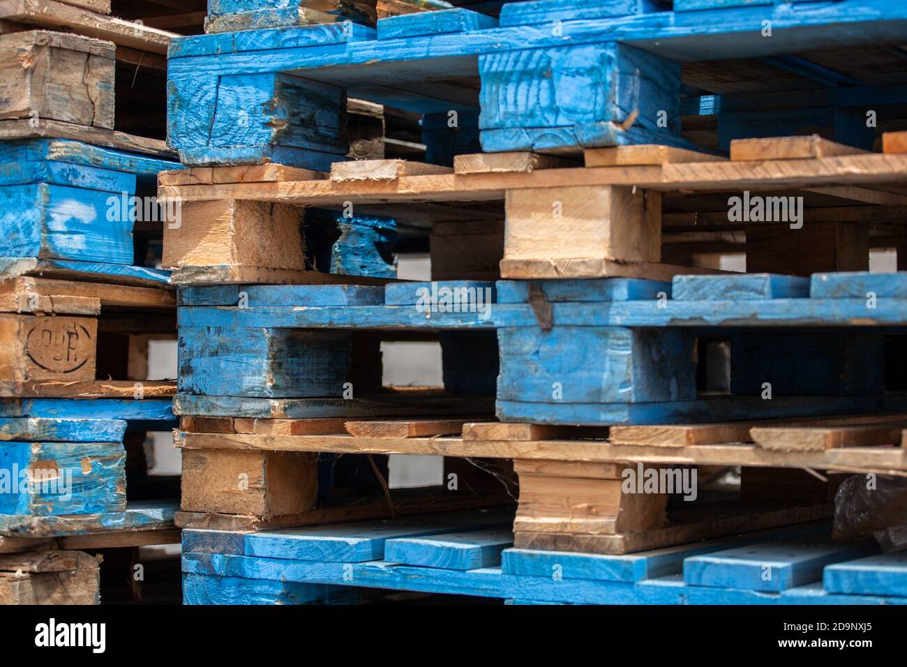 The wooden shipping pallets stacked on top of one another Stock Photo ...