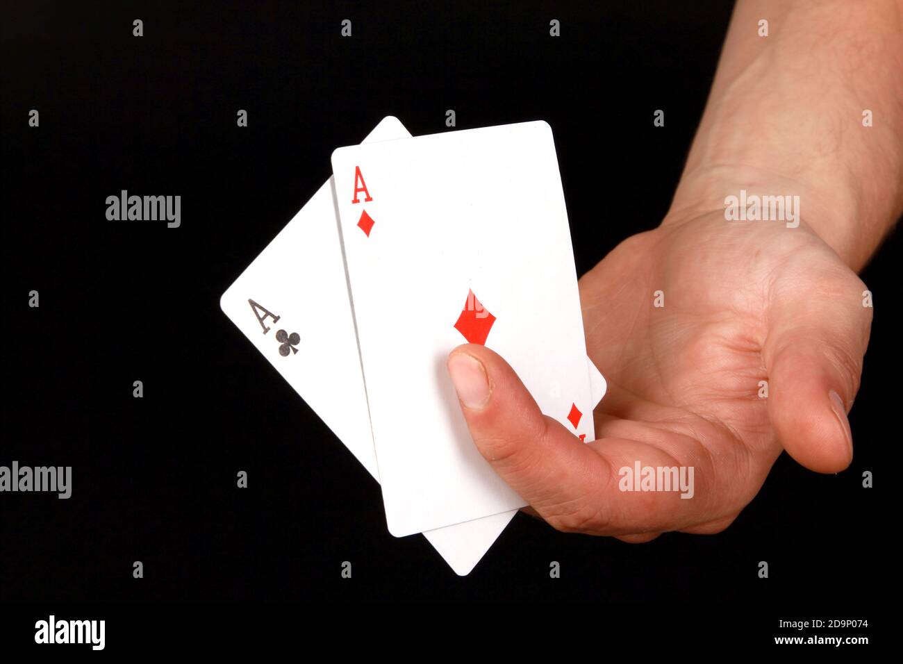 A closeup shot of a person holding two ace cards Stock Photo - Alamy