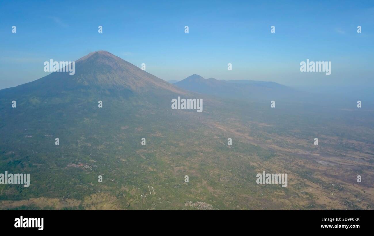 Beautiful sunrise on the volcano. View of Agung volcano from the peak ...