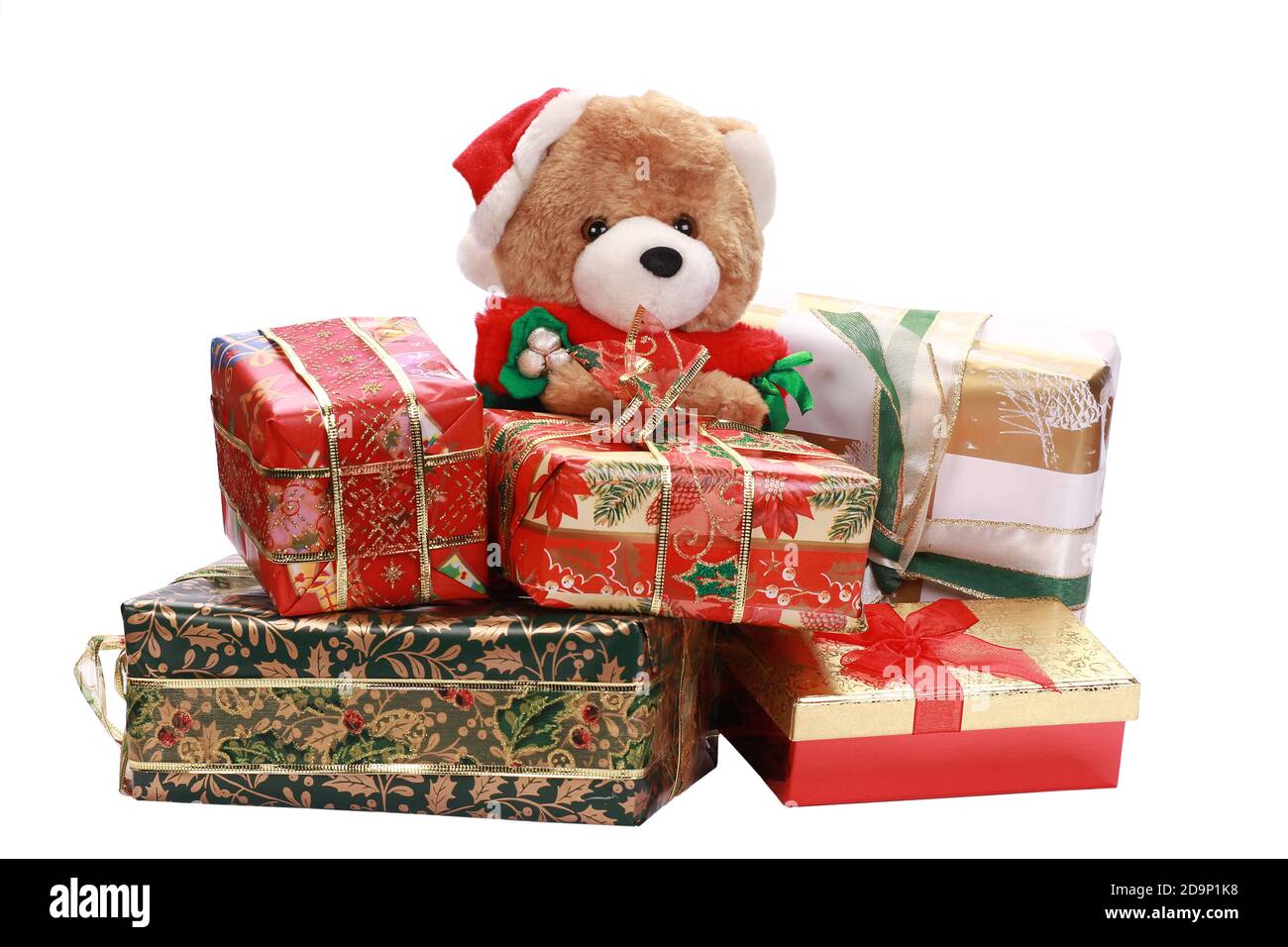 A bunch of beautifully wrapped Christmas gifts with a cute teddy bear ...