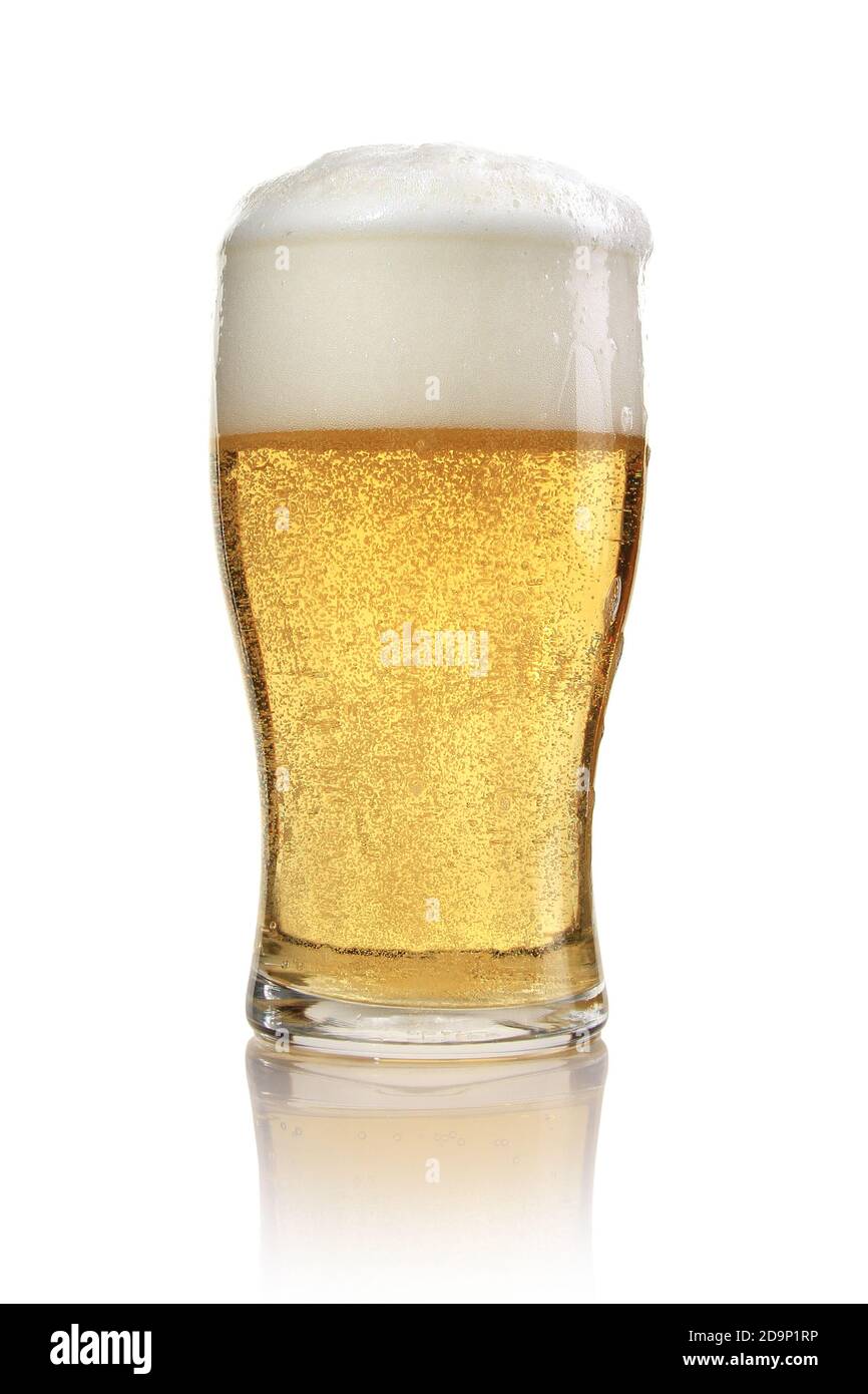 A vertical shot of a glass of bubbly beer with foam Stock Photo - Alamy