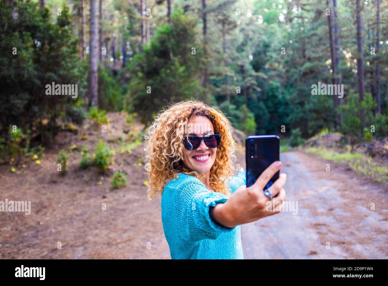 Cheerful beautiful caucasian woman adult take selfie picture in the ...