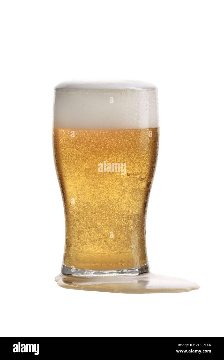A vertical shot of a glass of bubbly beer with foam isolated on a white ...