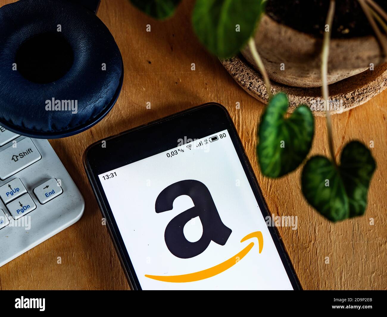 In this photo illustration an Amazon logo is seen displayed on a ...
