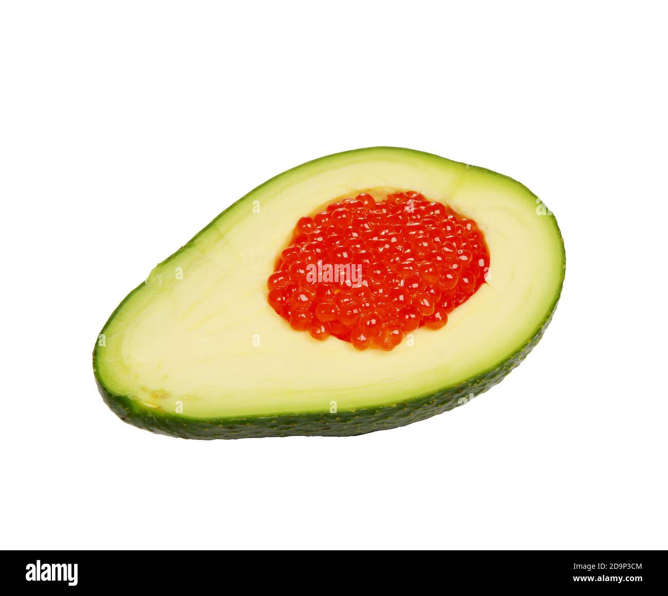An avocado with orange caviar in the pit hole isolated on a white ...