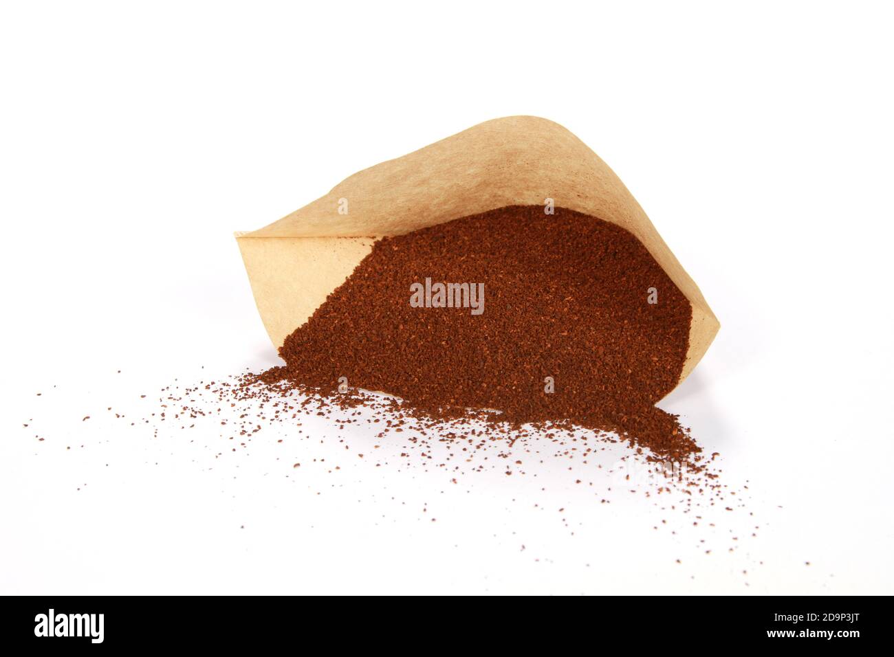 A pile of freshly ground coffee in a filter isolated on a white ...
