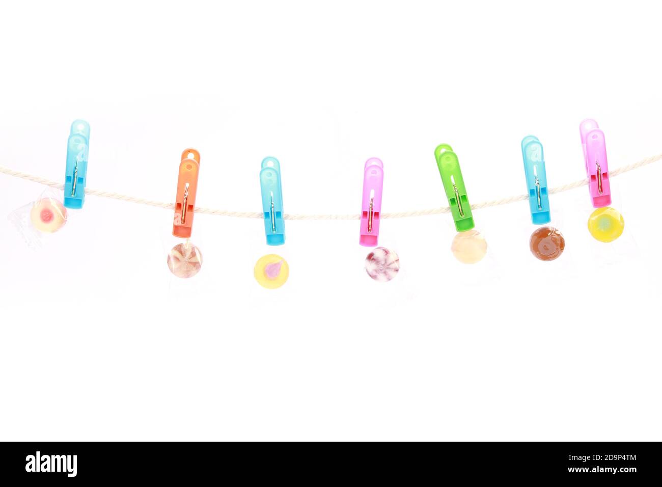 Collection of various pegs on white background Stock Photo - Alamy