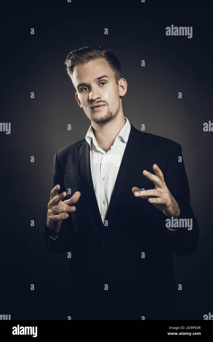 Young man dressed in suit studio portrait Stock Photo - Alamy