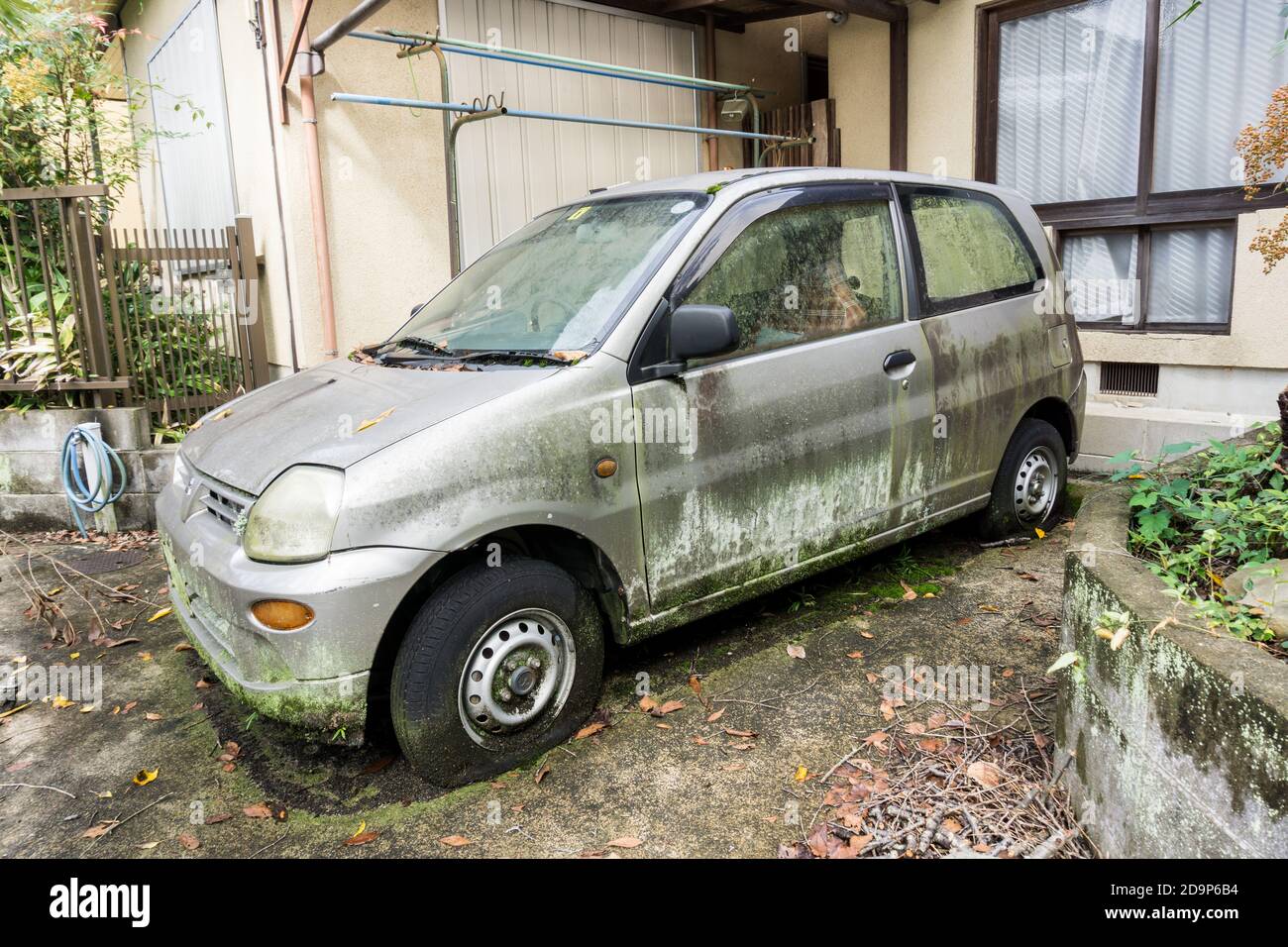 Dirty and dilapidated Japanese Mitsubishi Minica kei car, or mini car ...