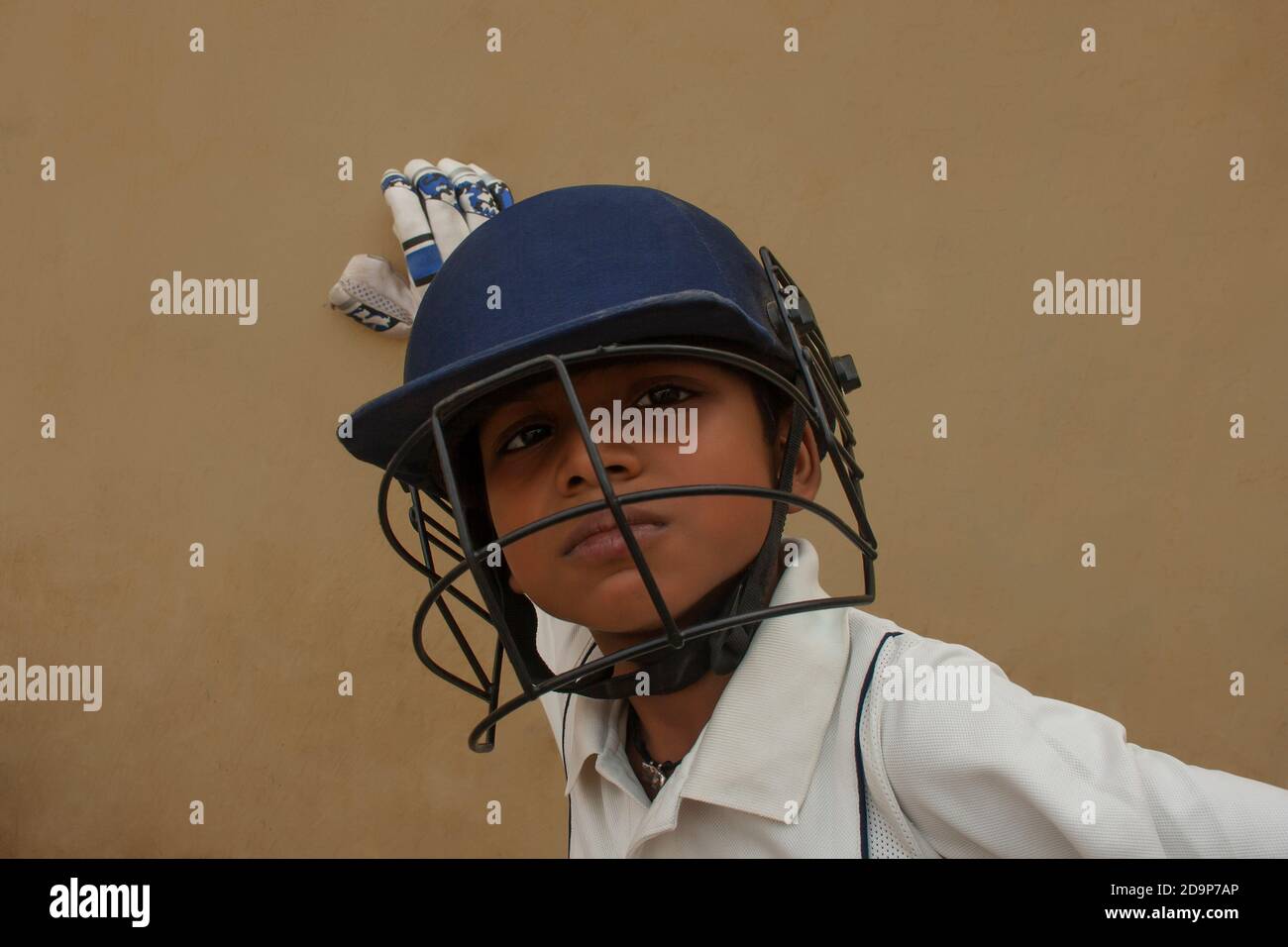 Confident boy wearing cricket helmet and ready for playing Stock Photo ...