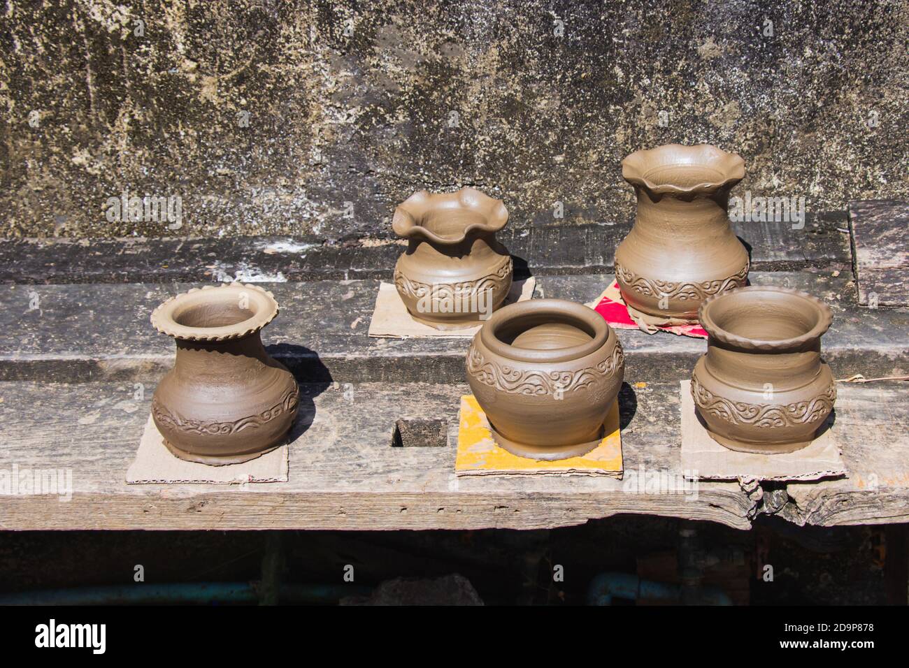 Clay pots made by hand of Thai traditional pottery jar placed in the ...