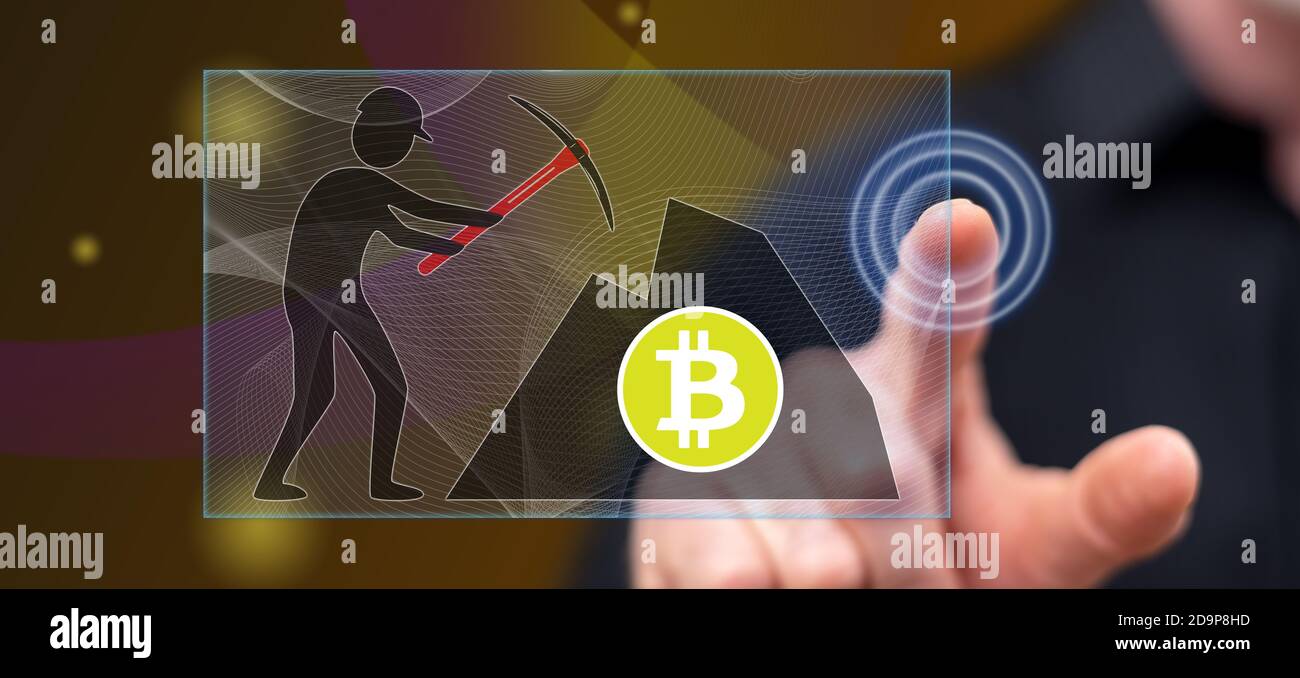 Man touching a bitcoin mining concept on a touch screen with his finger ...