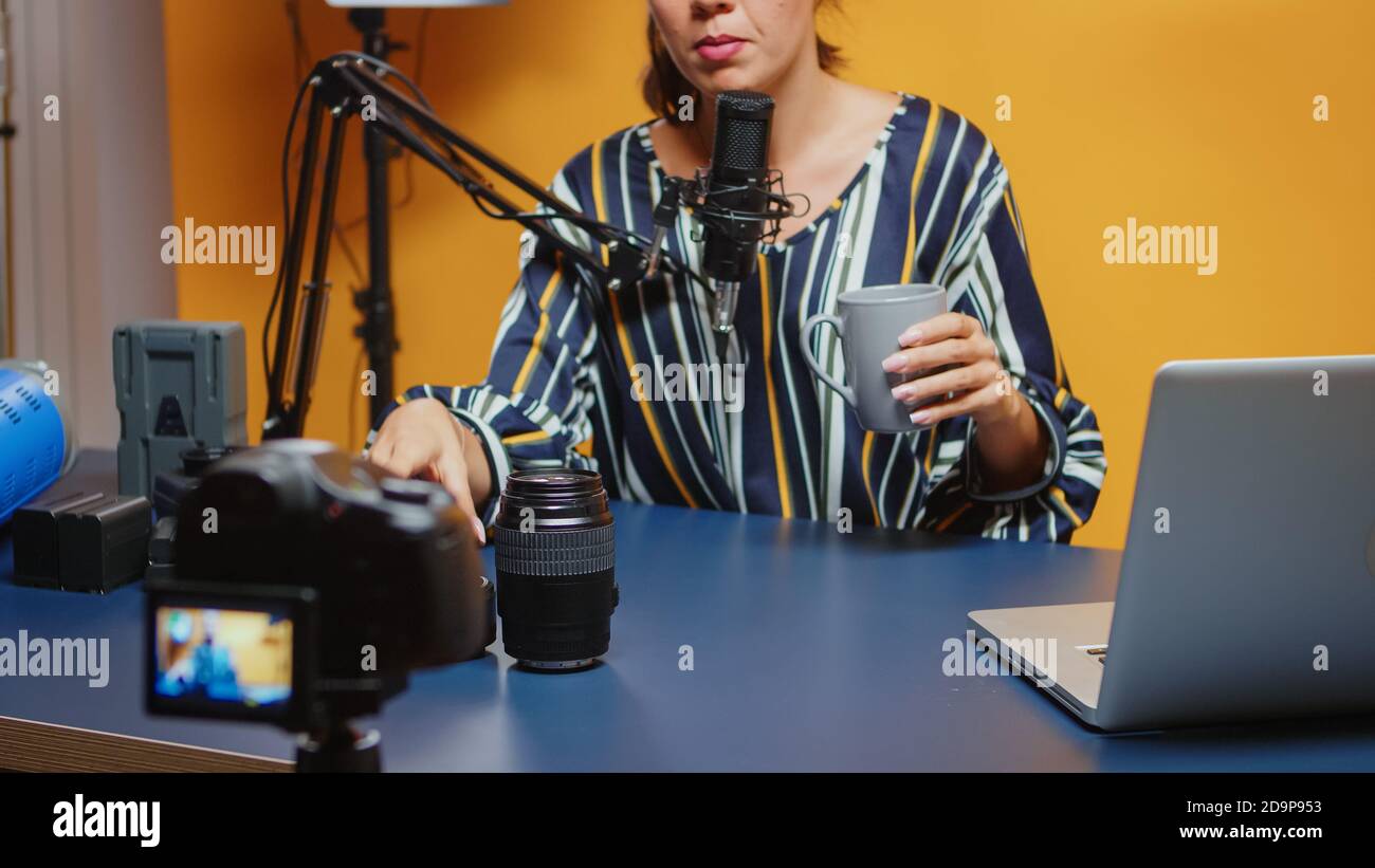 New media influencer talking about camera lens, comparing them. Content ...