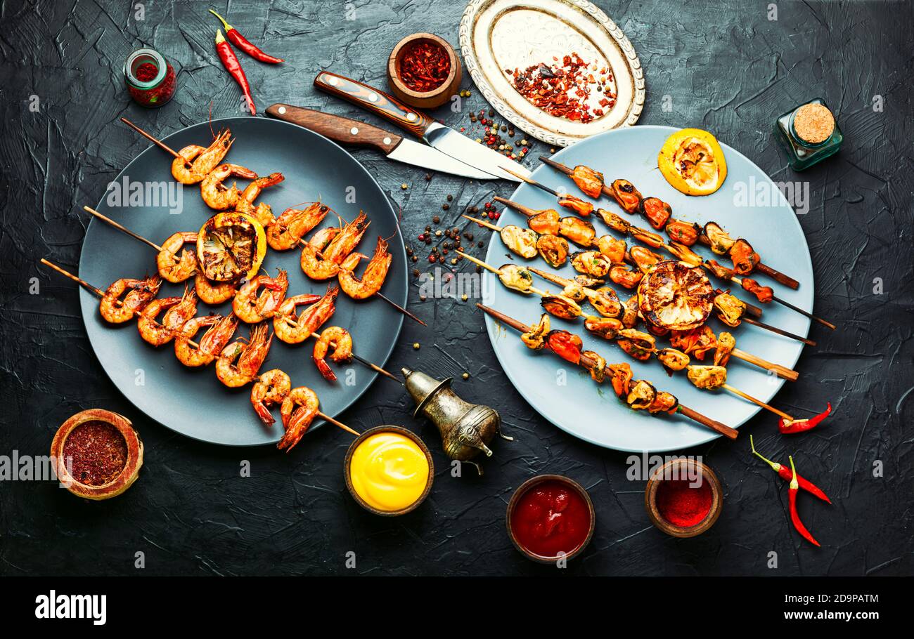 Grilled prawns,mussels and stuffed snails Stock Photo - Alamy