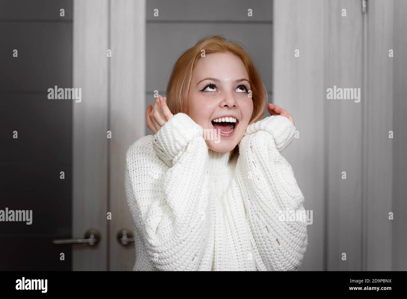 emotional beautiful red-haired girl raised her face up expressing ...