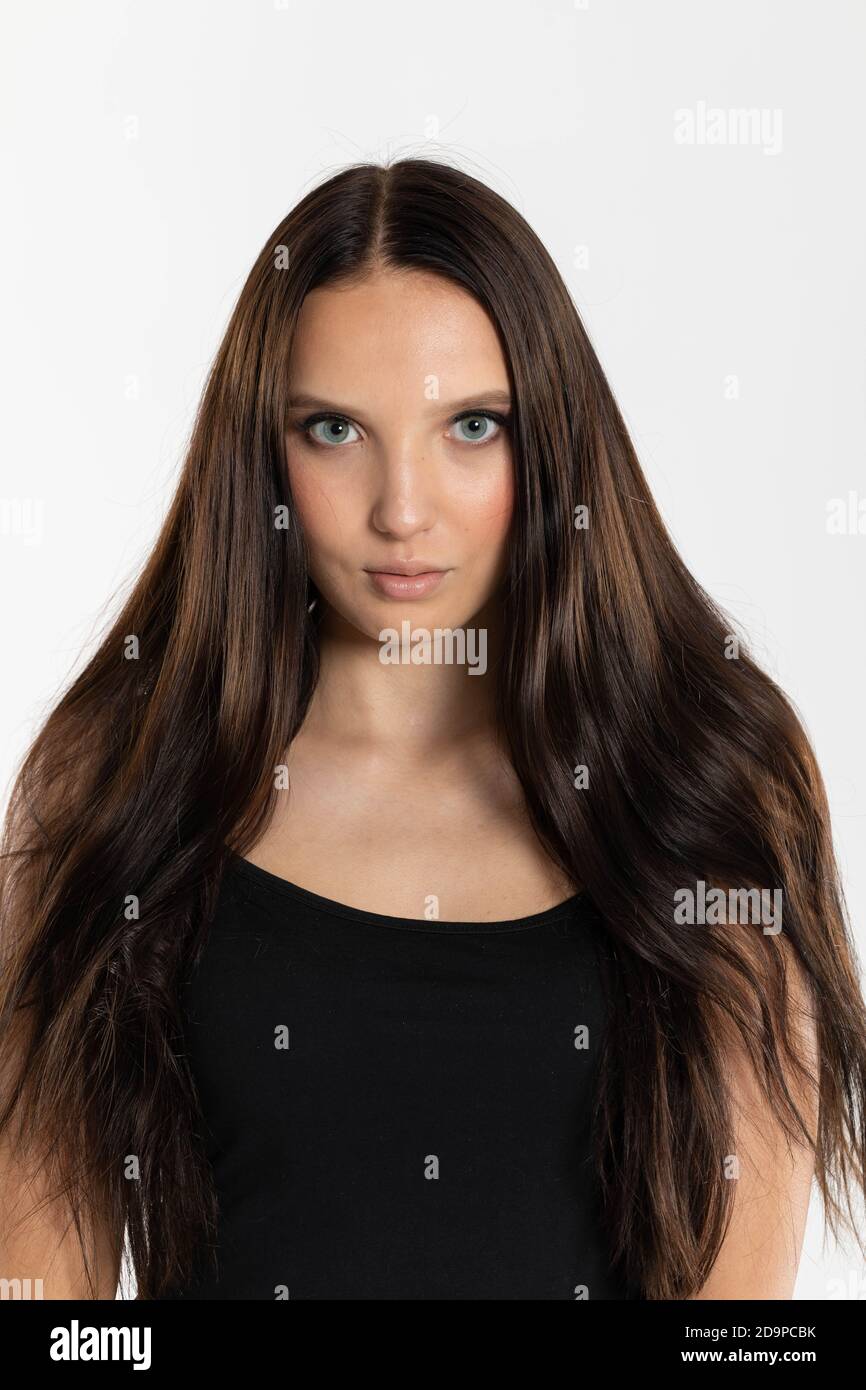 Shot straight ahead. The girl looks straight into the lens. The young ...