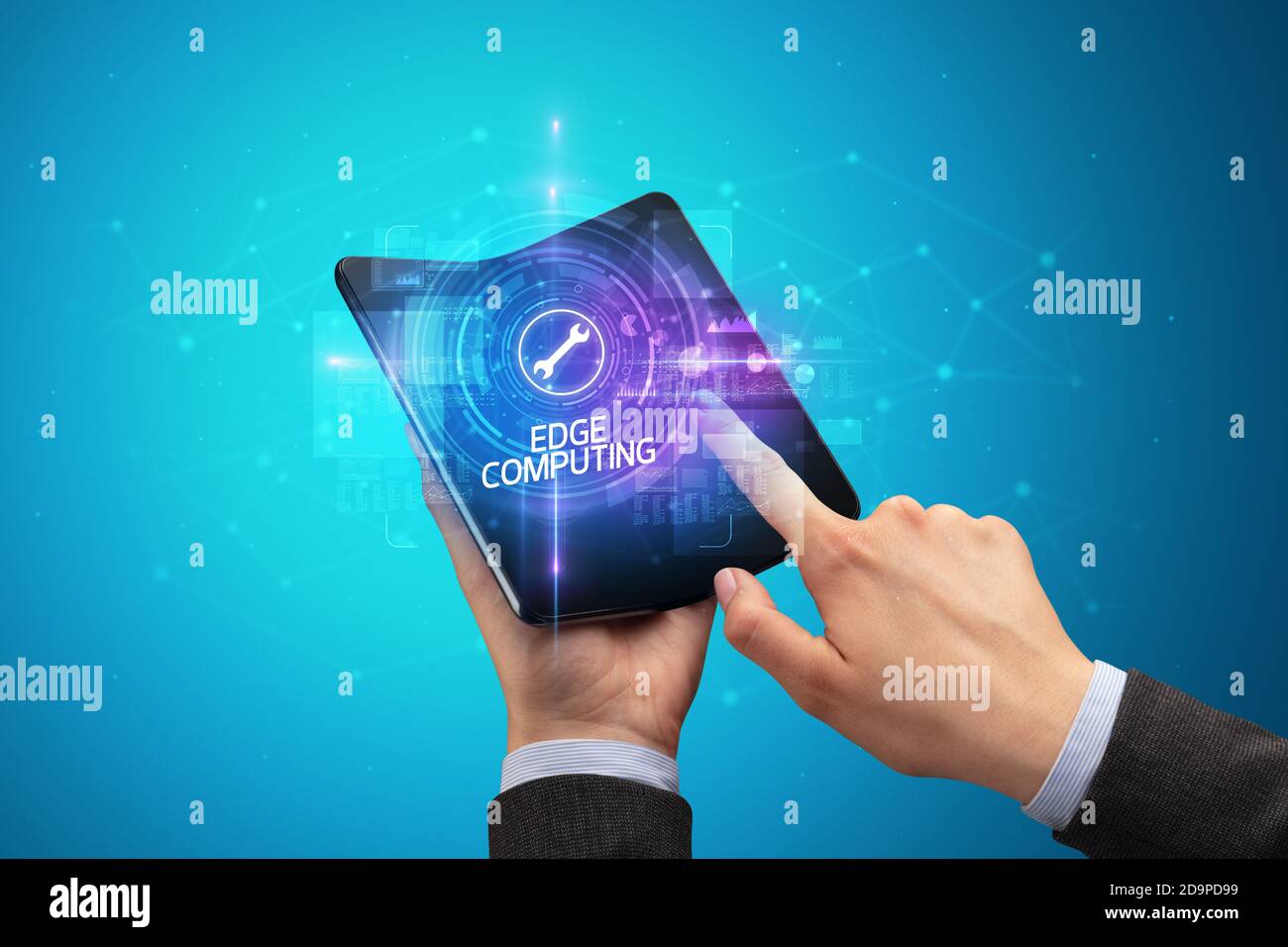 Businessman holding a foldable smartphone with INNOVATIONS inscription ...