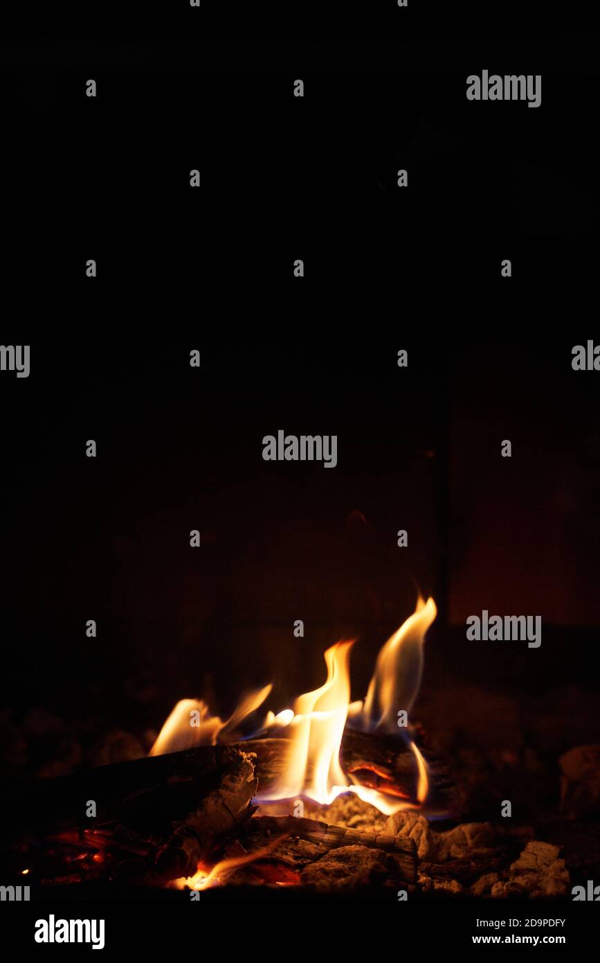 Wood burning in a fireplace to warm the house Stock Photo - Alamy