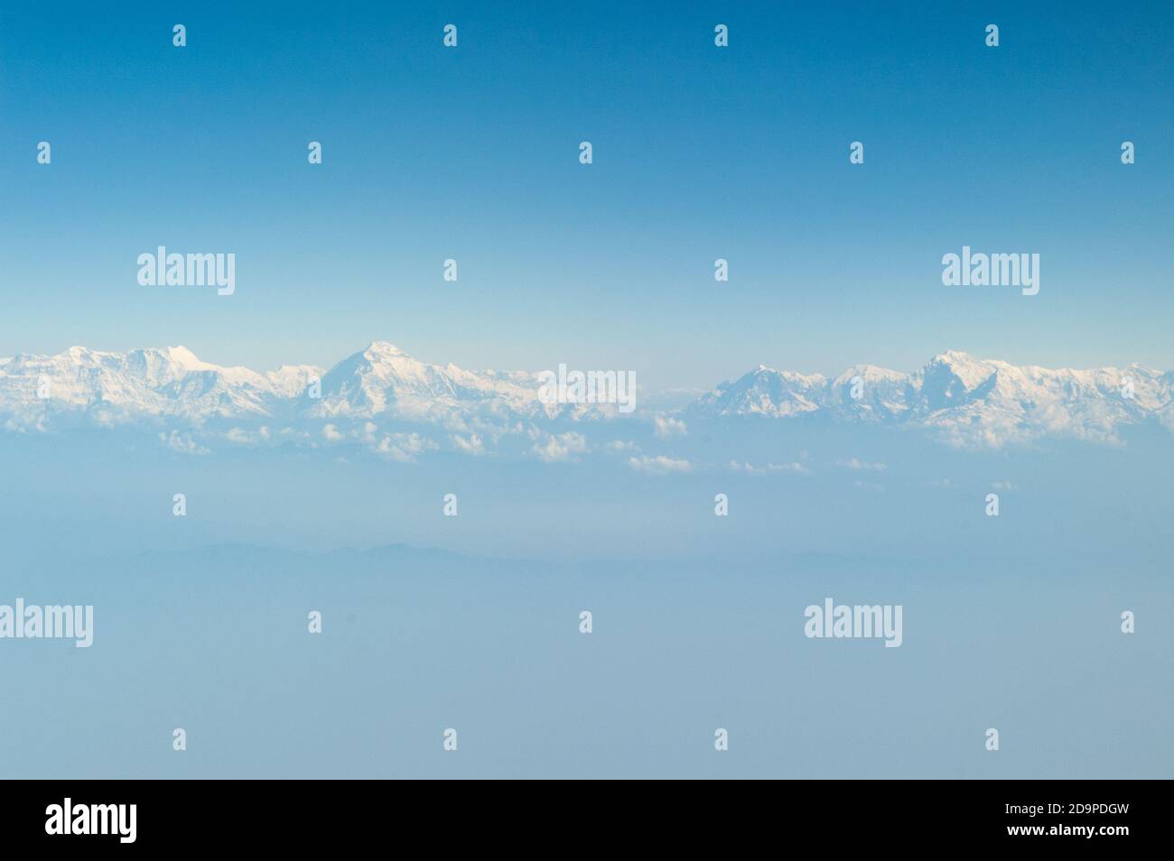 The Himalayan mountains seen from great distance and high altitude ...