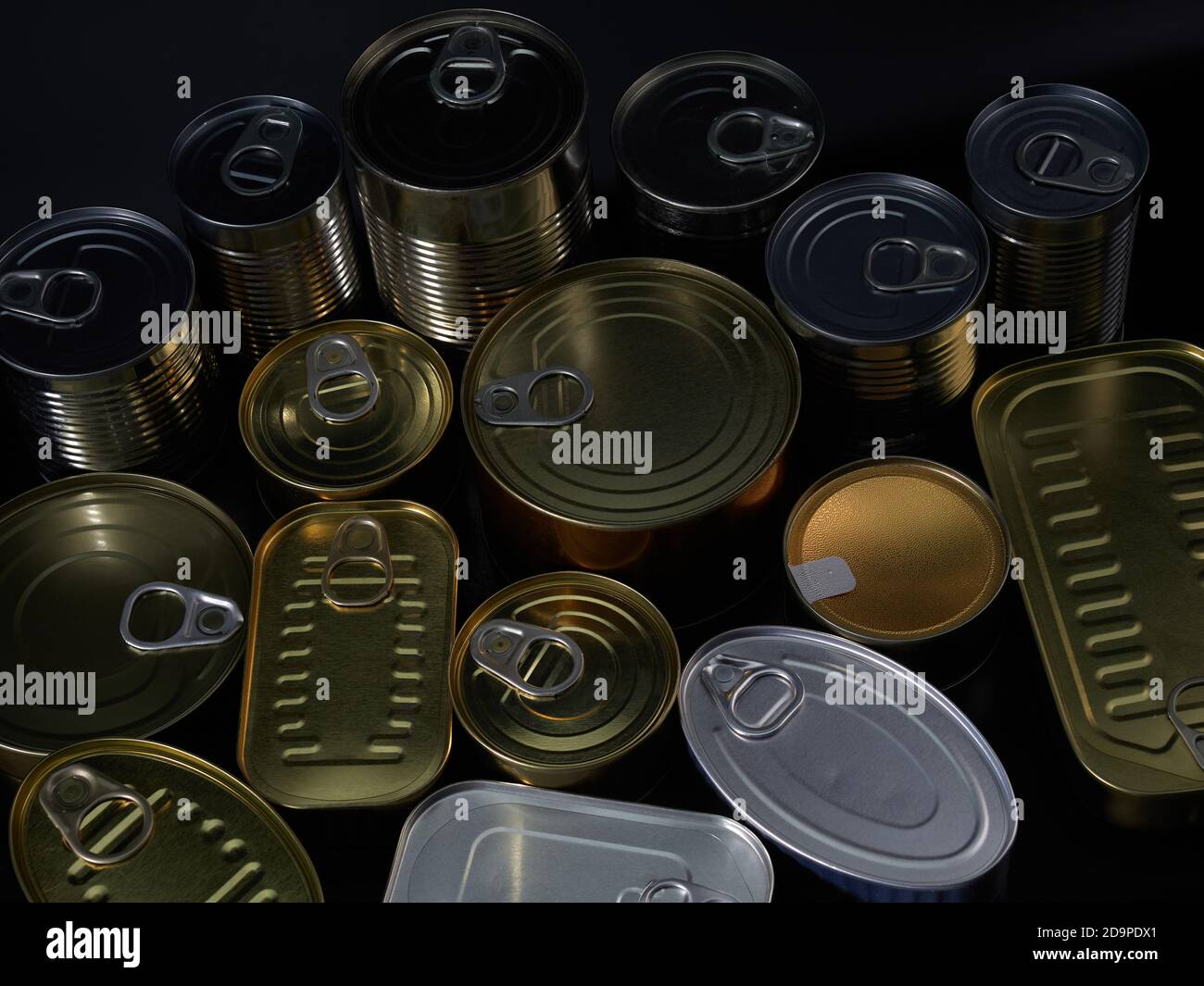 Different types of cans with prepared foods for consumption, vegetables ...