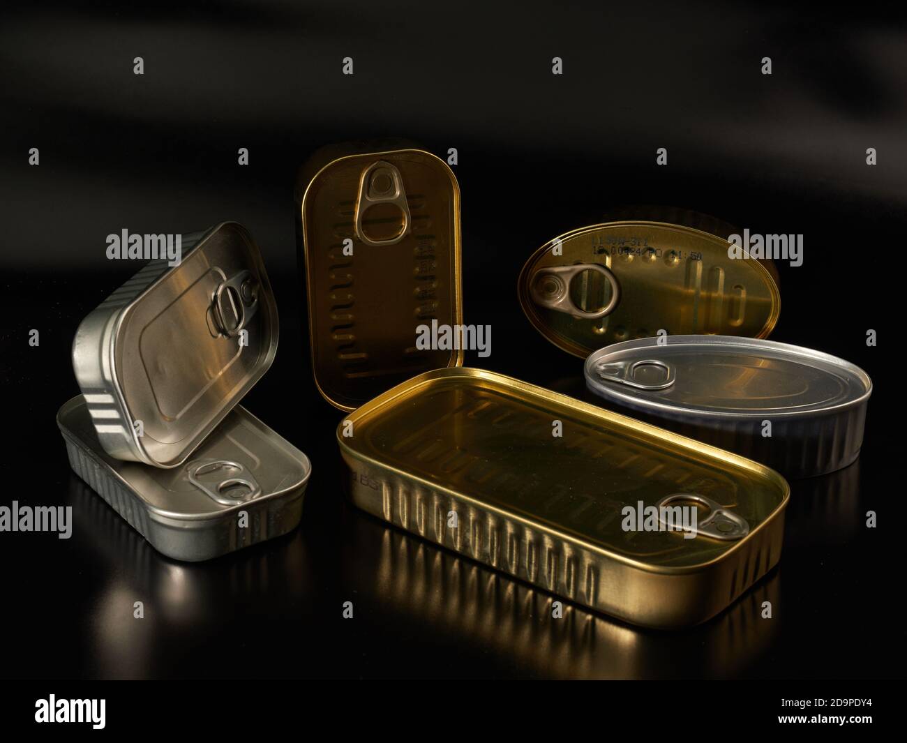 Different types of cans with prepared foods for consumption, vegetables ...