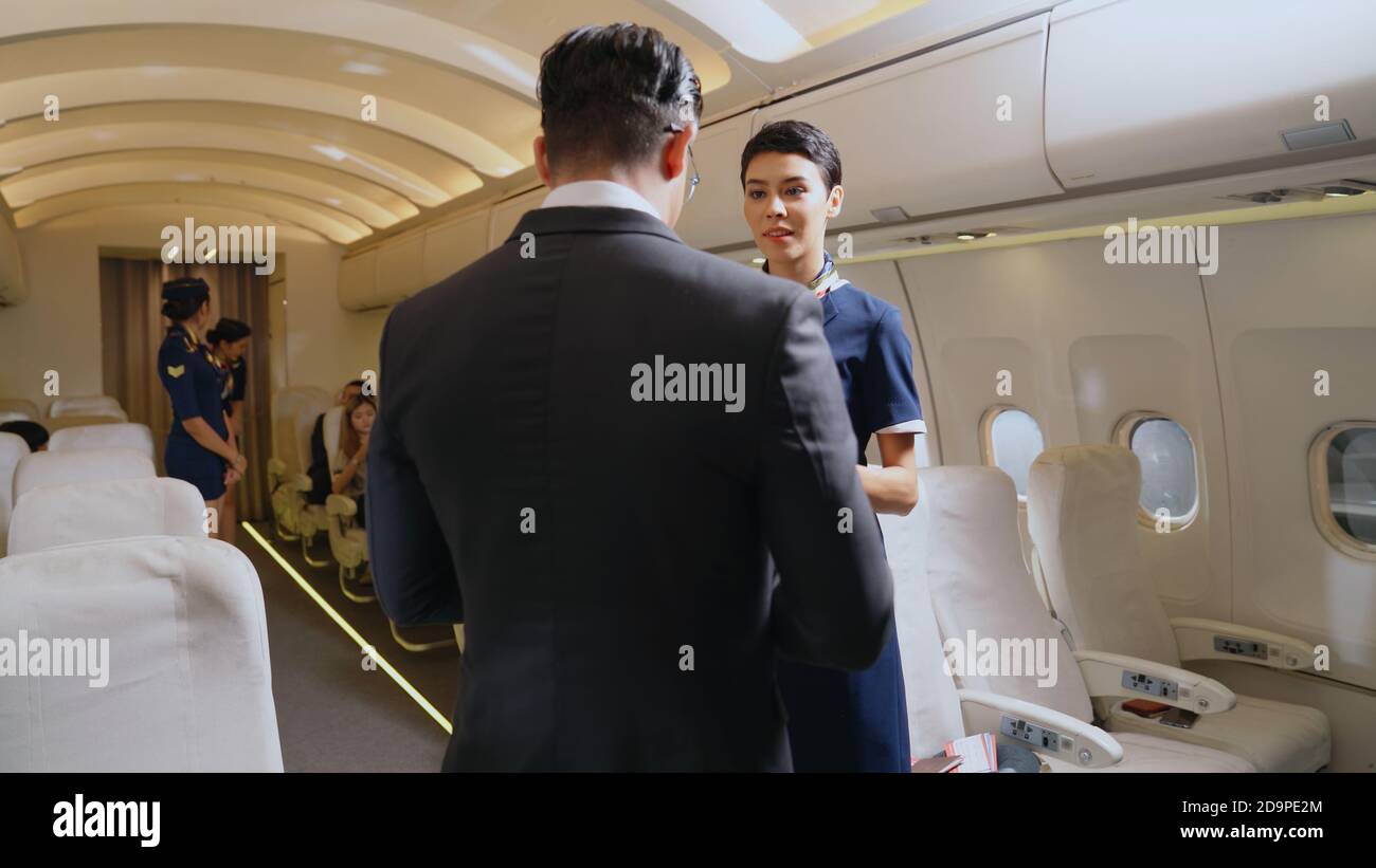 Flight attendant greeting passenger hi-res stock photography and images ...