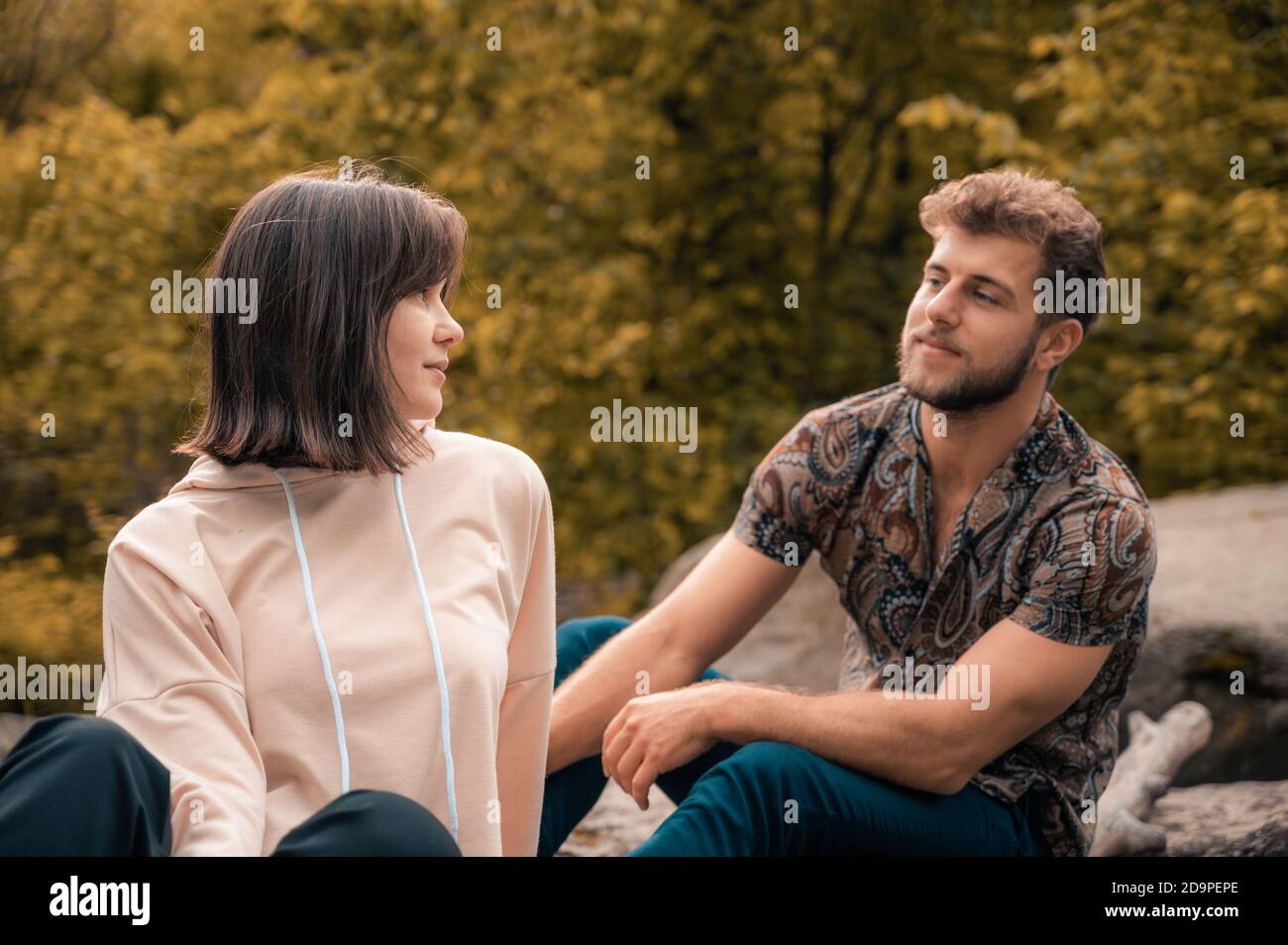 Lovely young couple walking in park, spending time together. Loving ...