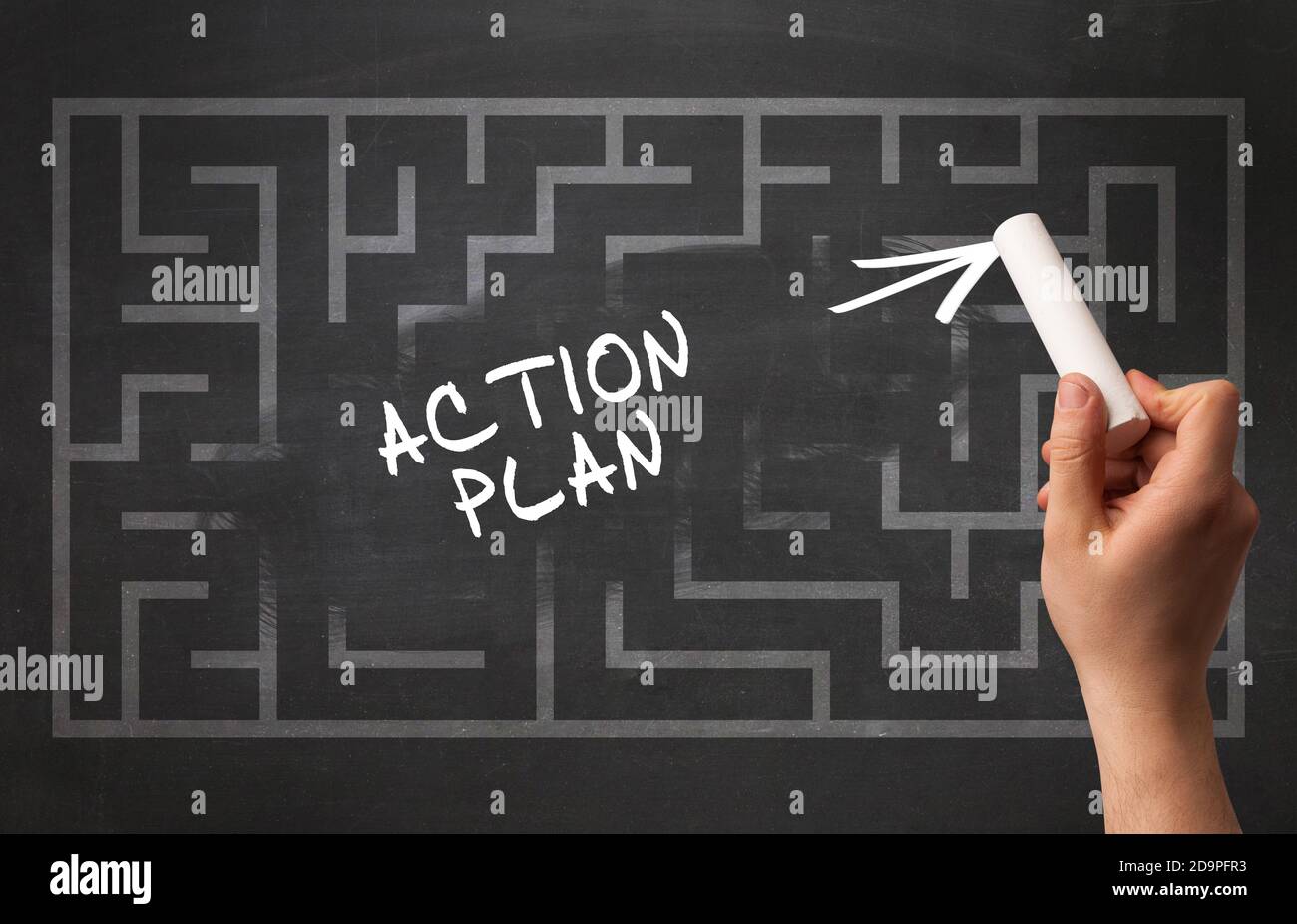 Hand drawing ACTION PLAN inscription with white chalk on blackboard ...