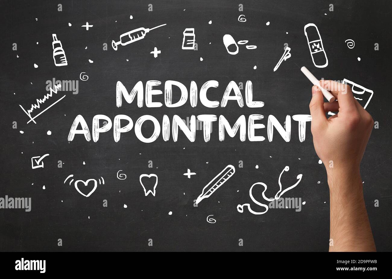 Hand drawing MEDICAL APPOINTMENT inscription with white chalk on ...