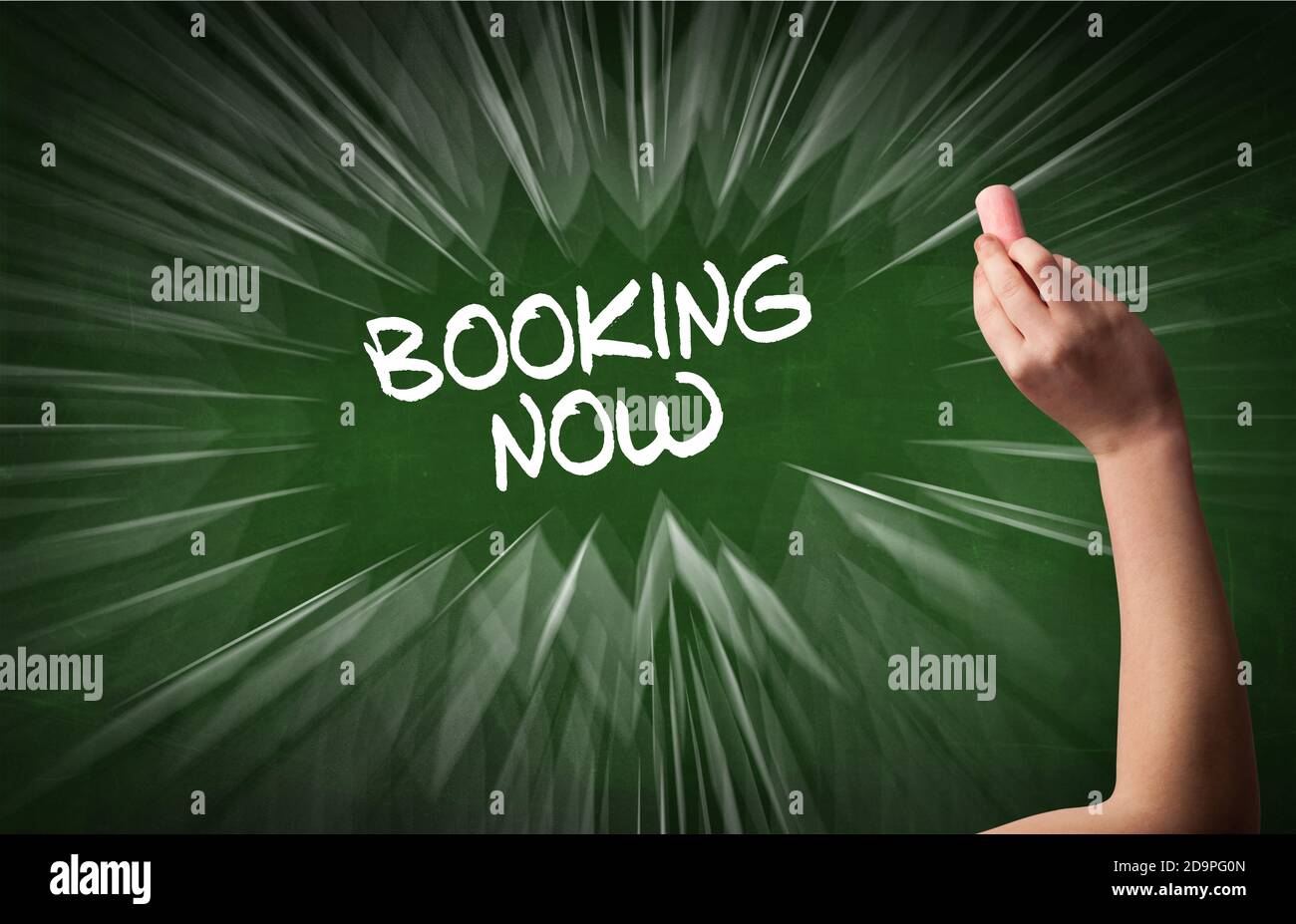 Hand drawing BOOKING NOW inscription with white chalk on blackboard ...