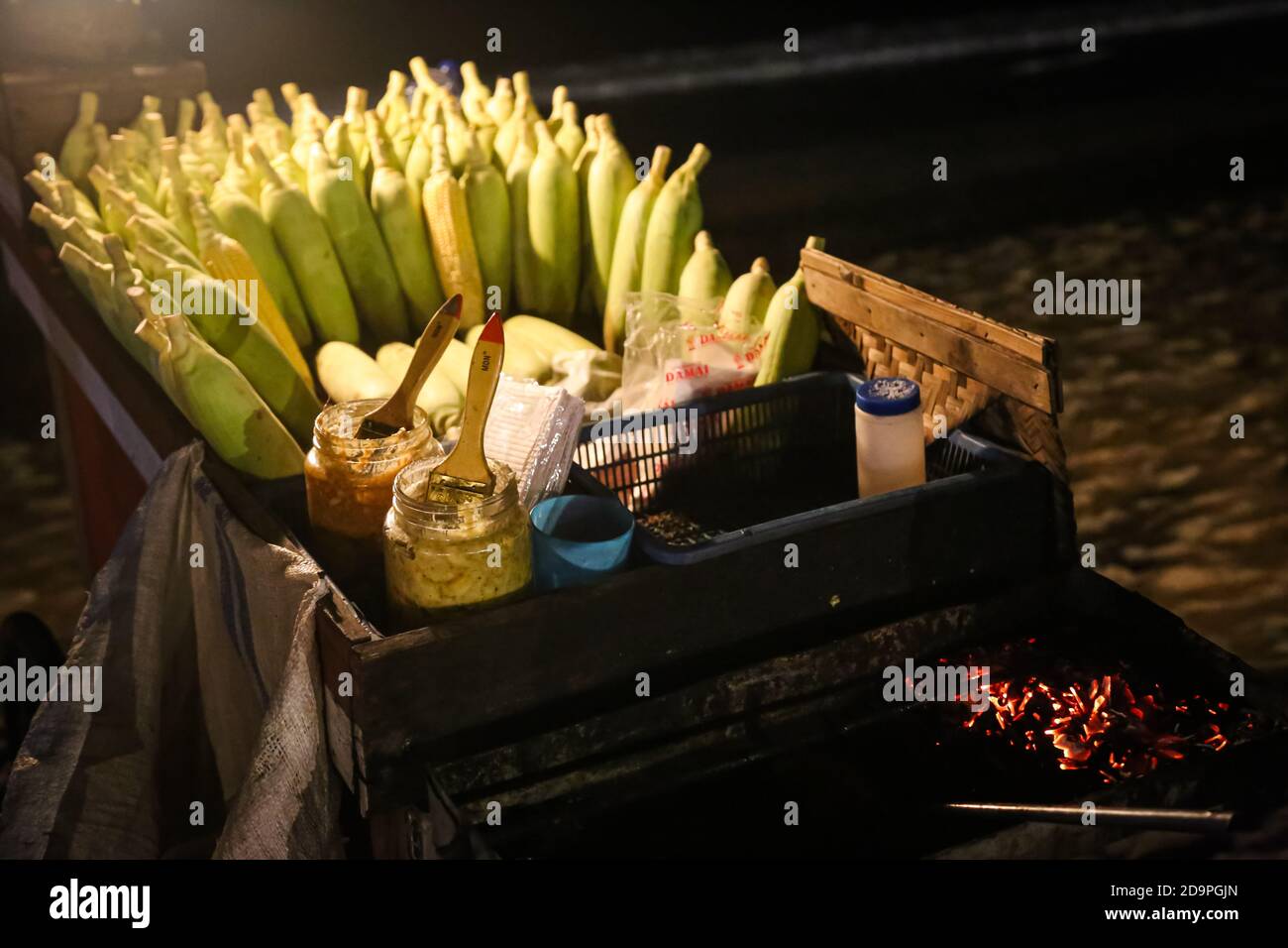 A charcoal grilled corn, typical asian snacks Stock Photo - Alamy