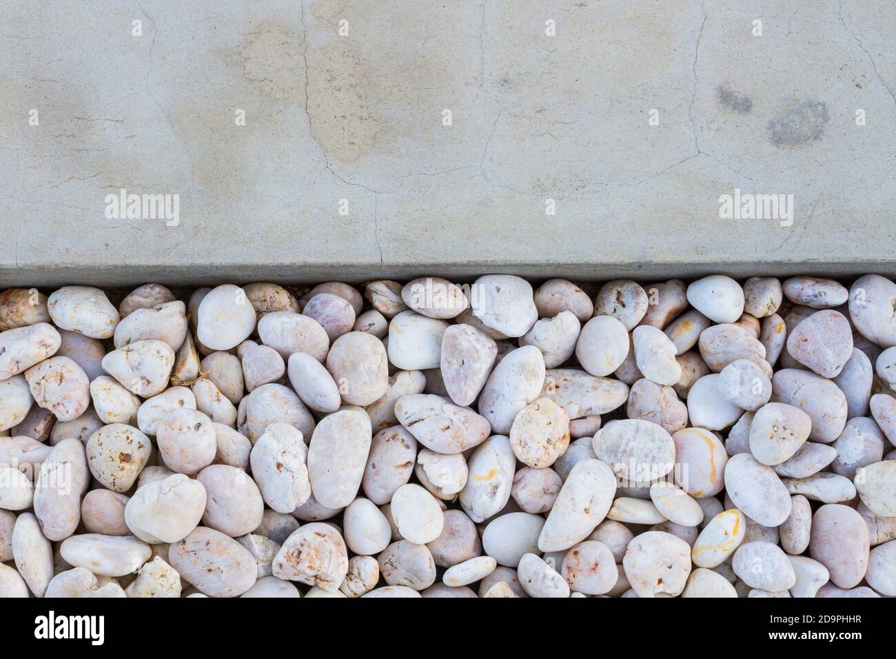 white pebble stones with gray concrete ground Stock Photo - Alamy