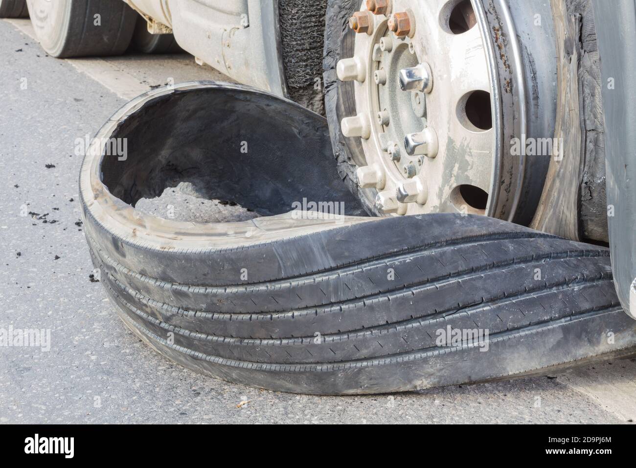 closeup damaged 18 wheeler semi truck burst tires by highway street ...