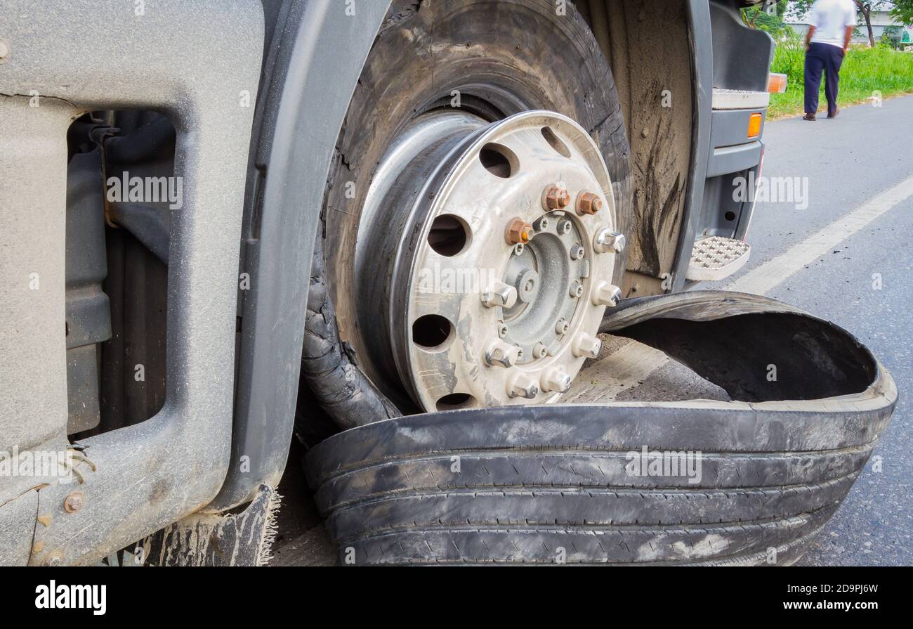 Damaged 18 wheeler semi truck burst tires by highway street, with ...