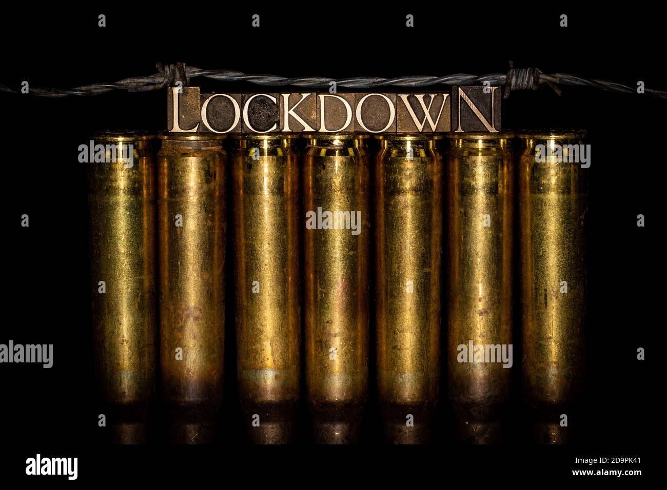Lockdown text formed with real authentic typeset letters on 50 caliber ...