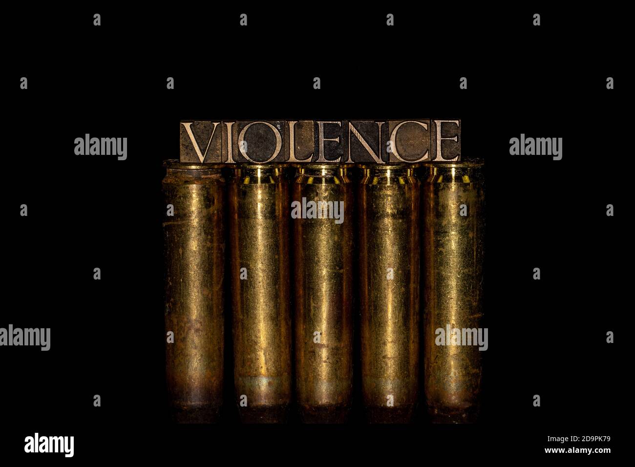 Violence text formed with real authentic typeset letters on top of row ...