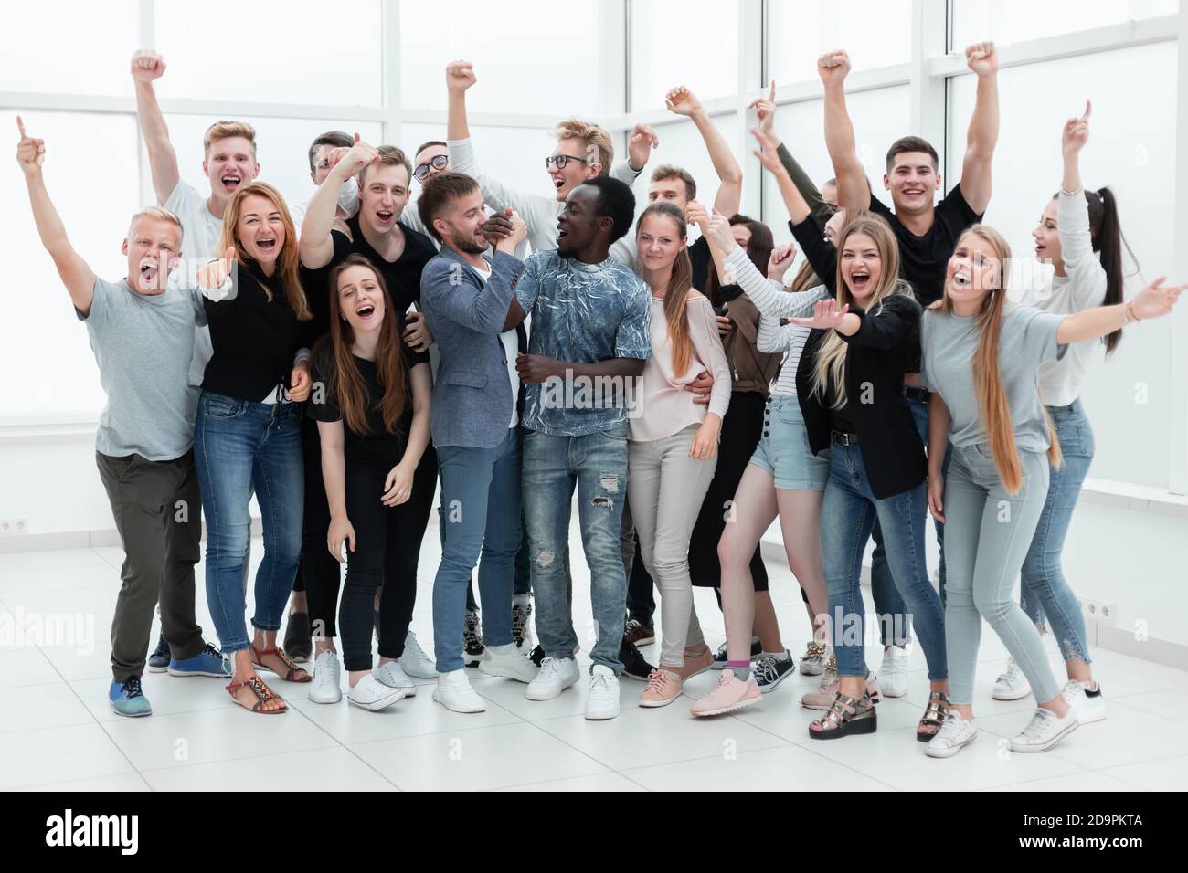 team of happy young people showing their success Stock Photo - Alamy